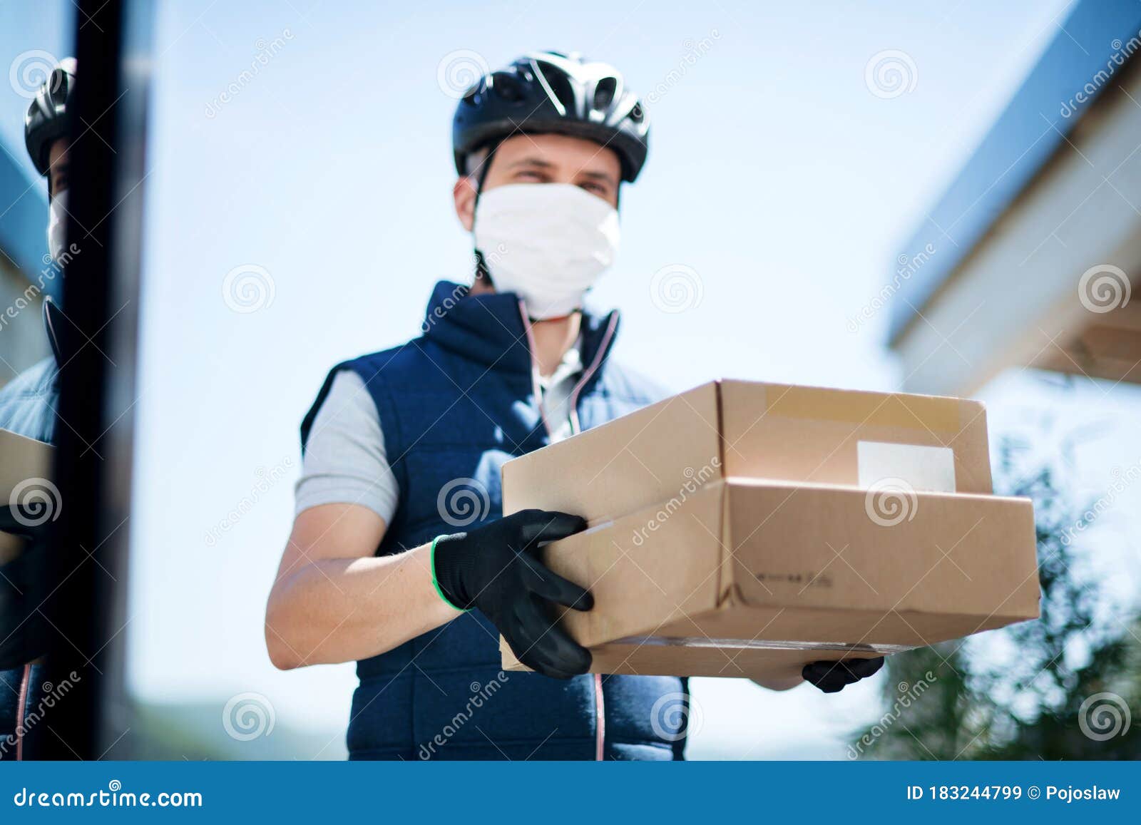 Courier with Face Mask Delivering Parcel, Corona Virus and Quarantine ...