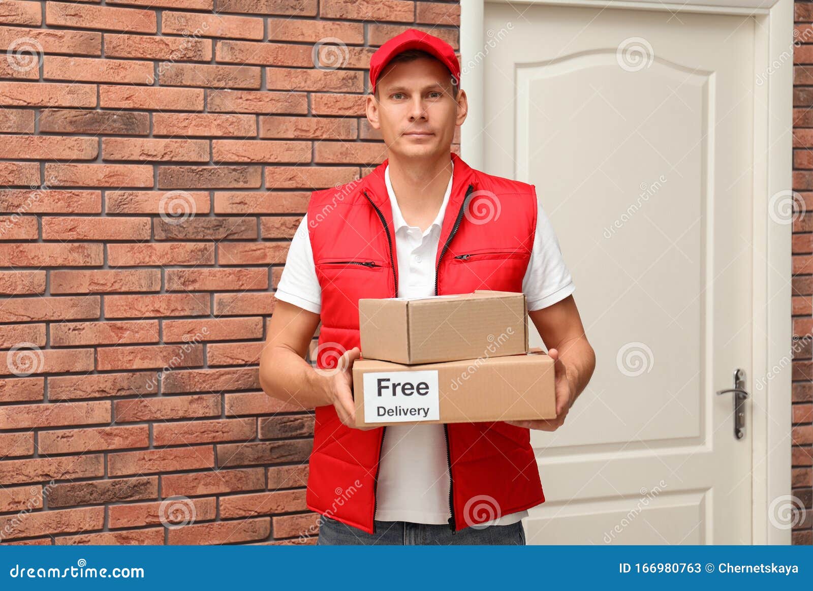 Courier Holding Parcels with Sticker Free Delivery Stock Image - Image ...