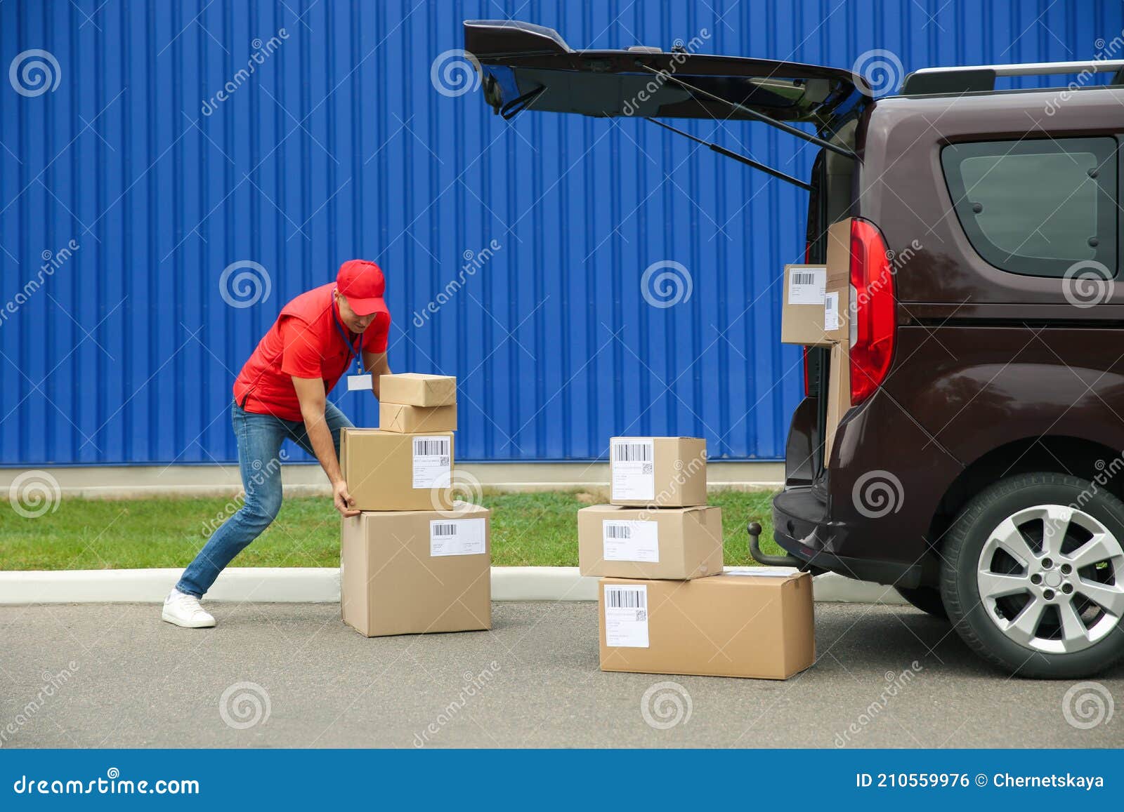 Courier Loading Packages in Car Trunk Outdoors Stock Photo - Image of ...