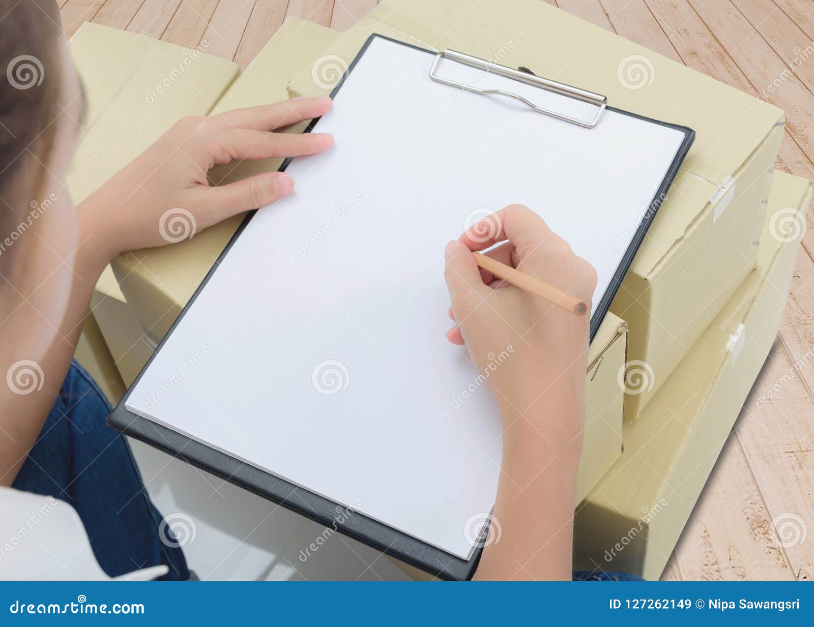 Courier Making Notes in Delivery Receipt among Parcels on Boxes Stock ...
