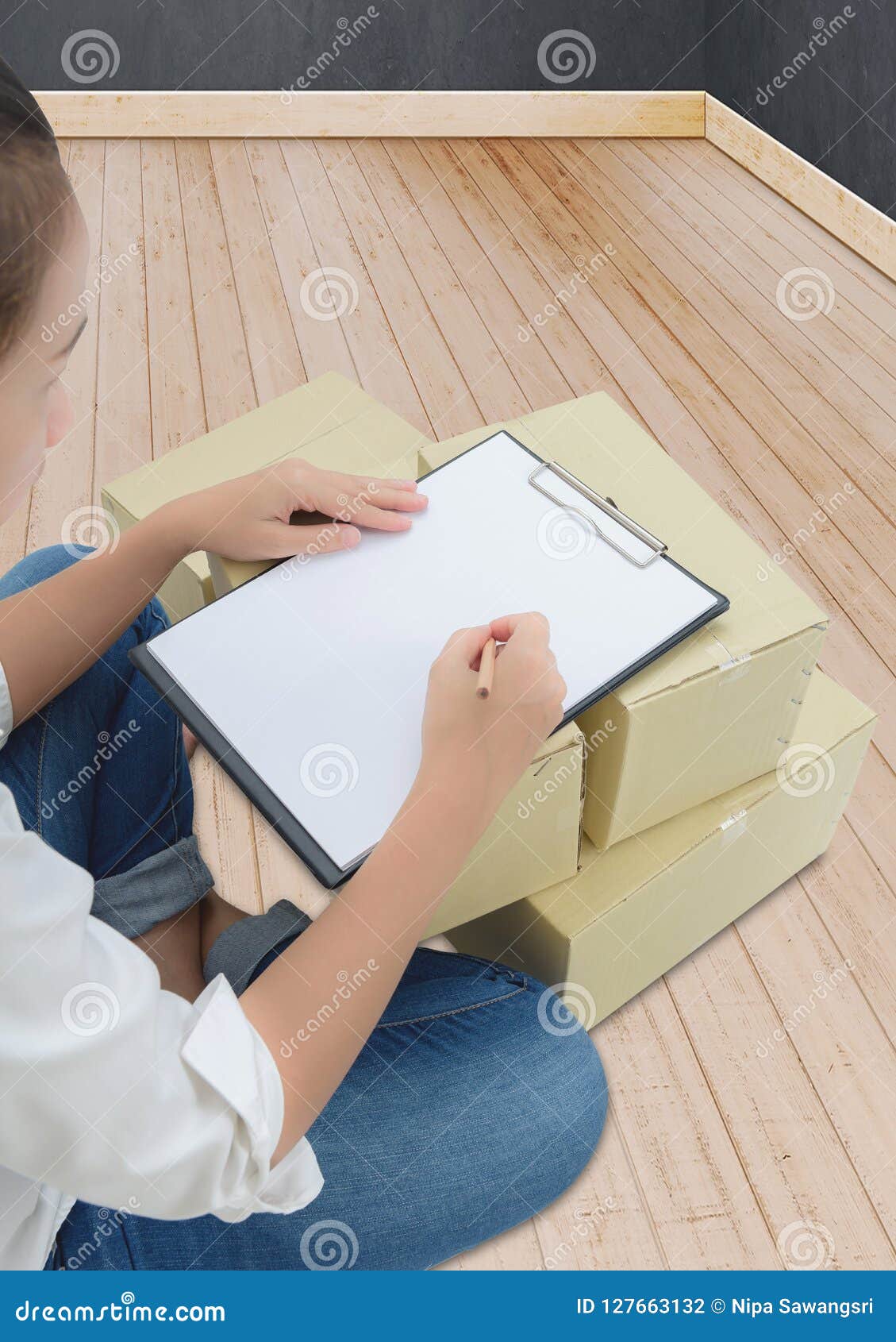 Courier Making Notes in Delivery Receipt among Parcels on Boxes Stock ...