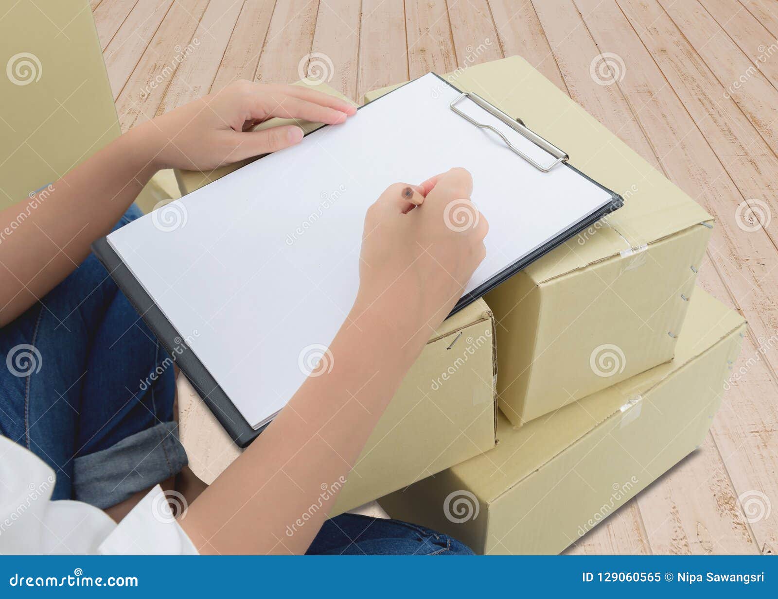 Courier Making Notes in Delivery Receipt among Parcels on Boxes Stock ...