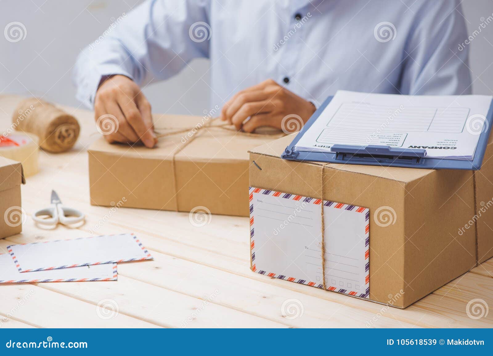 Courier Making Notes In Delivery Receipt Among Parcels On Boxes Stock ...