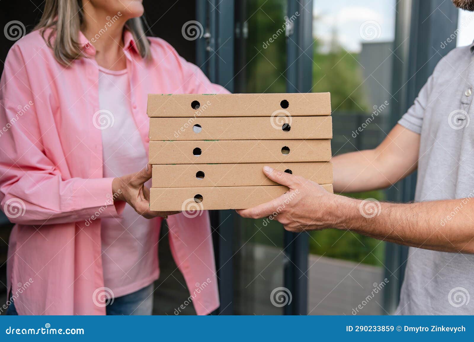 Courier Man Handling Pizza To Female Client. Stock Image - Image of ...