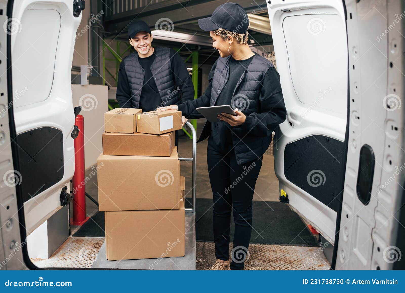 Couriers in Uniform Working Together. People Preparing Parcels for ...