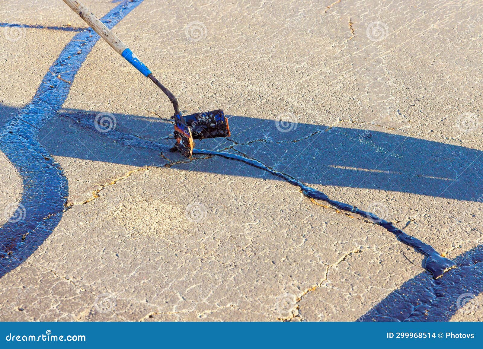 In Course of Worker Patching are Filled, Asphalt Cracks are Sealed ...