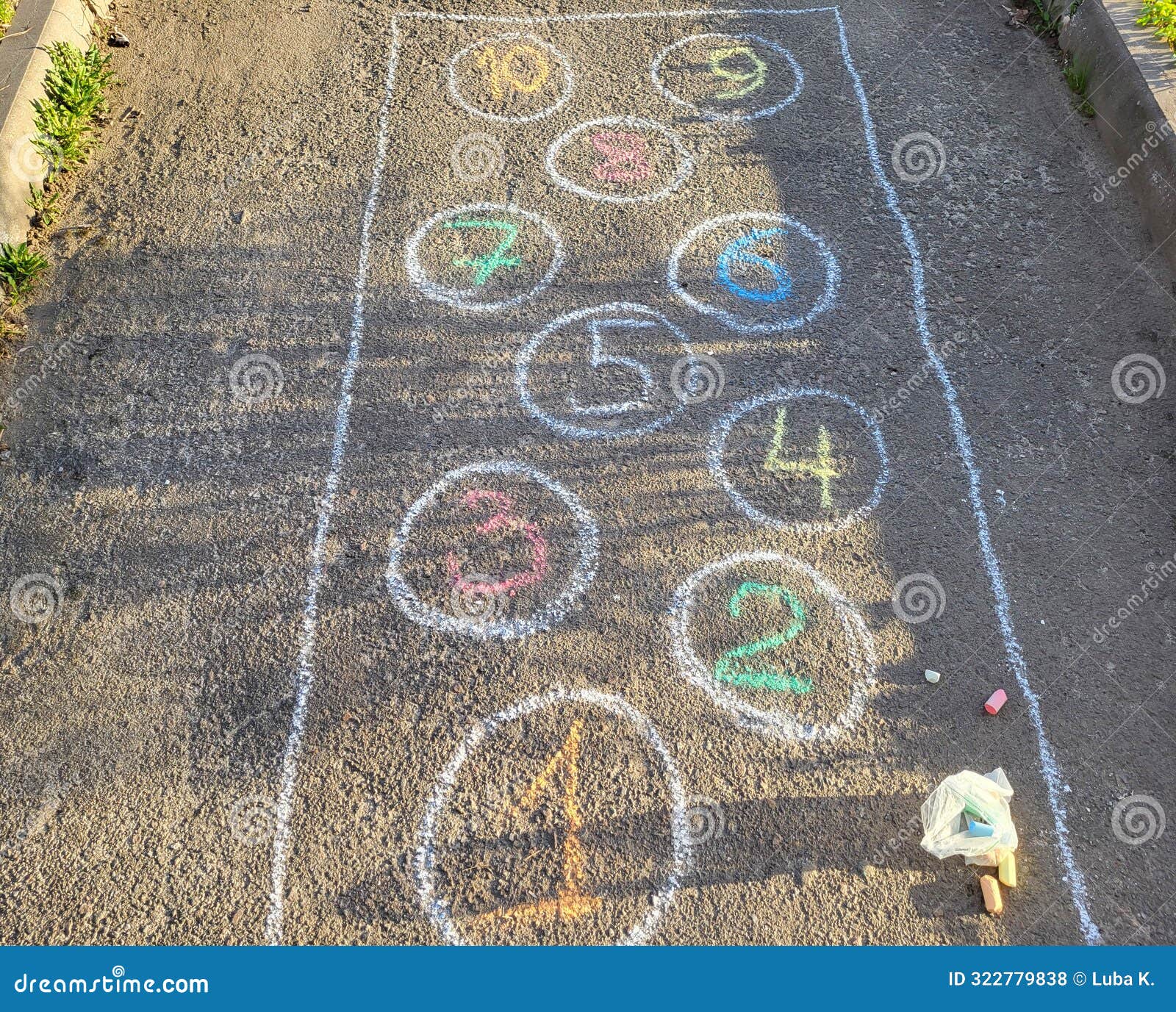 In the Courtyard on the Asphalt There is a Drawing of Classics in Chalk ...