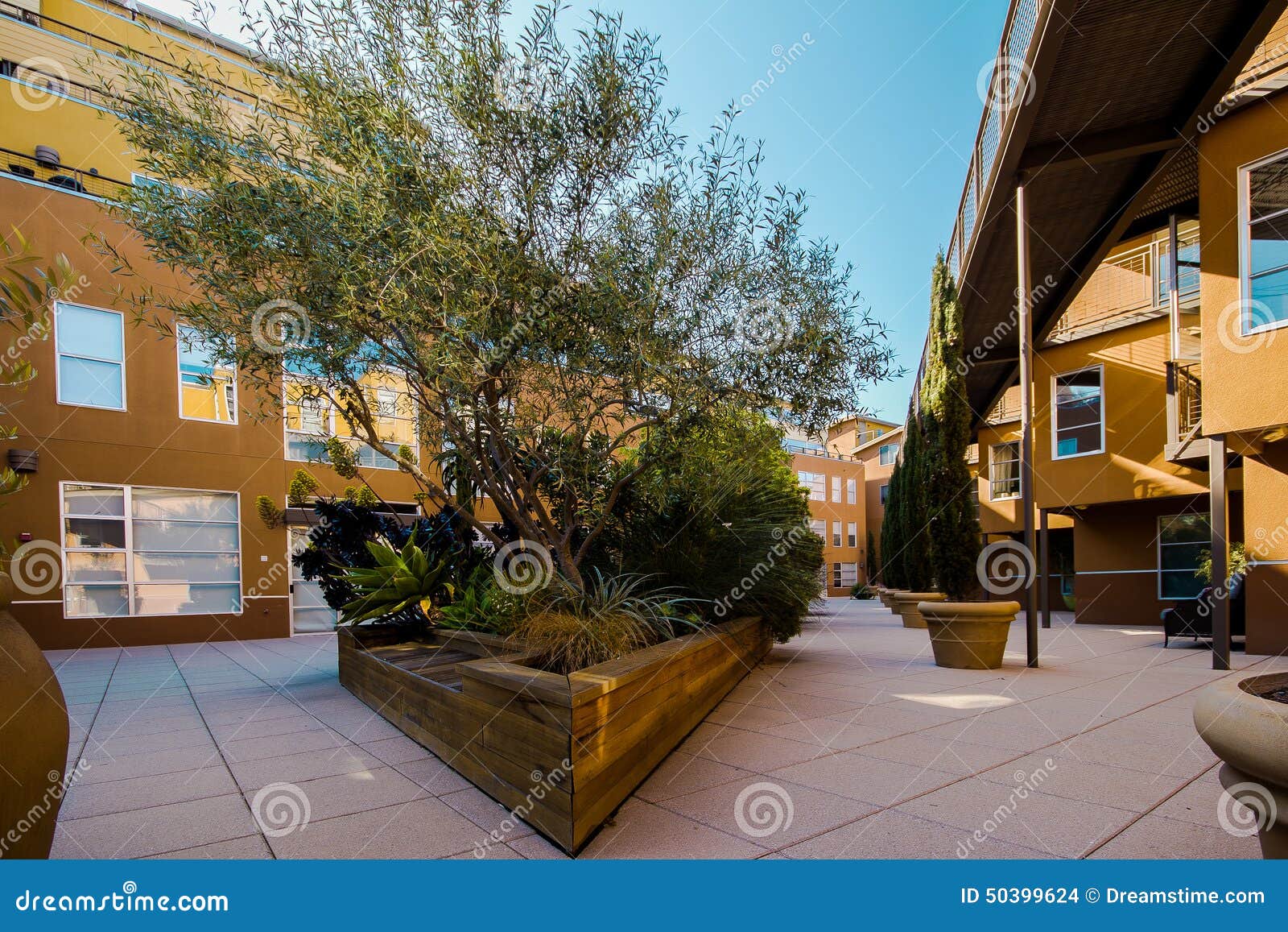 Courtyard at the Condos stock photo. Image of bench, condominiums ...
