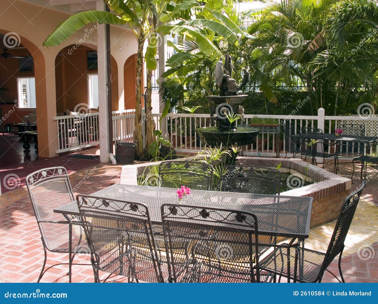 Courtyard Fountain with Tables Stock Photo - Image of resort, plants ...