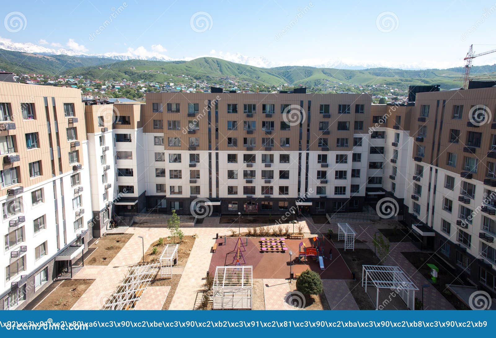The Courtyard of a New Multi-storey House with a Playground View from ...