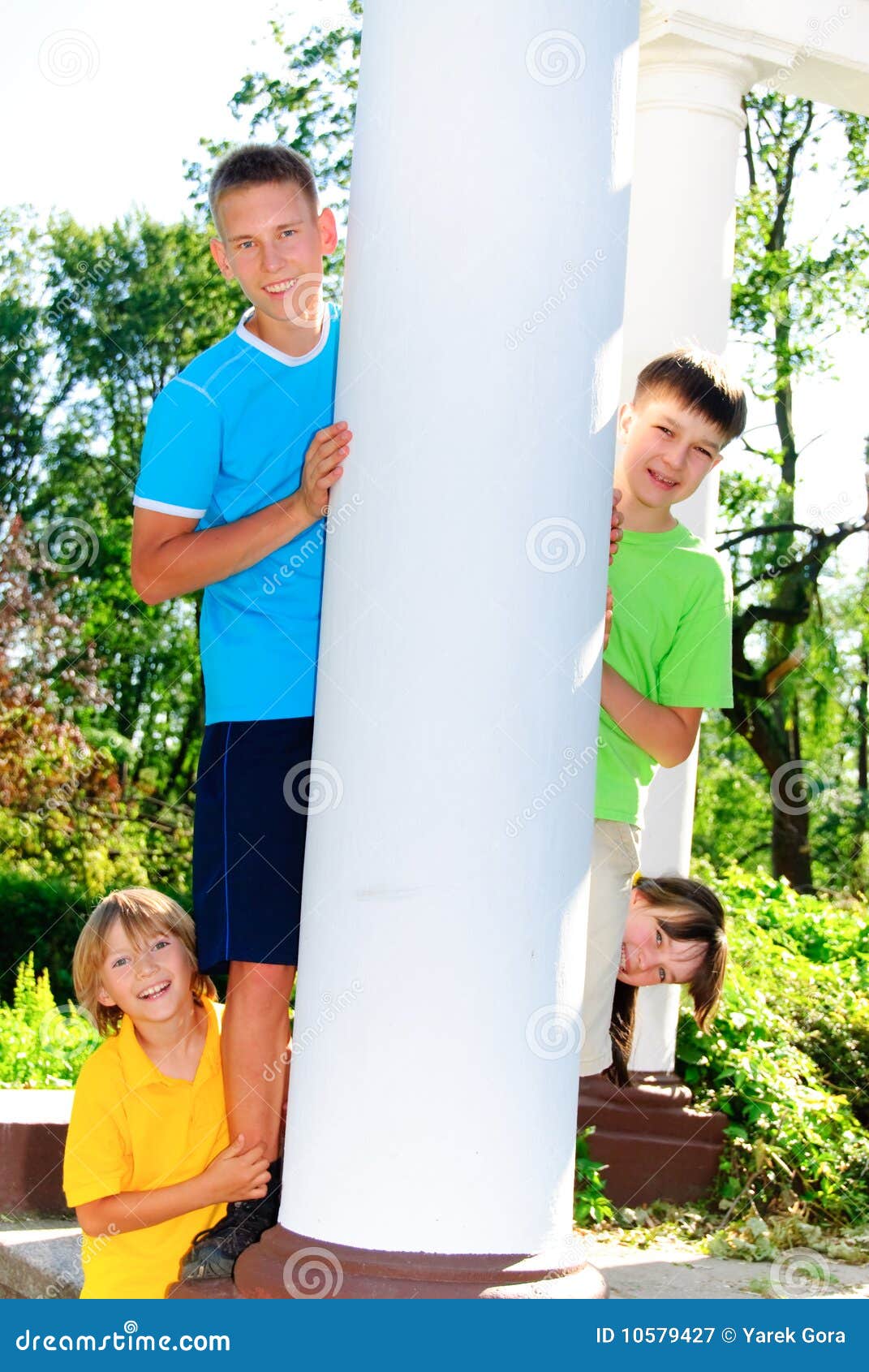 Cousins behind column stock image. Image of looking, sister - 10579427