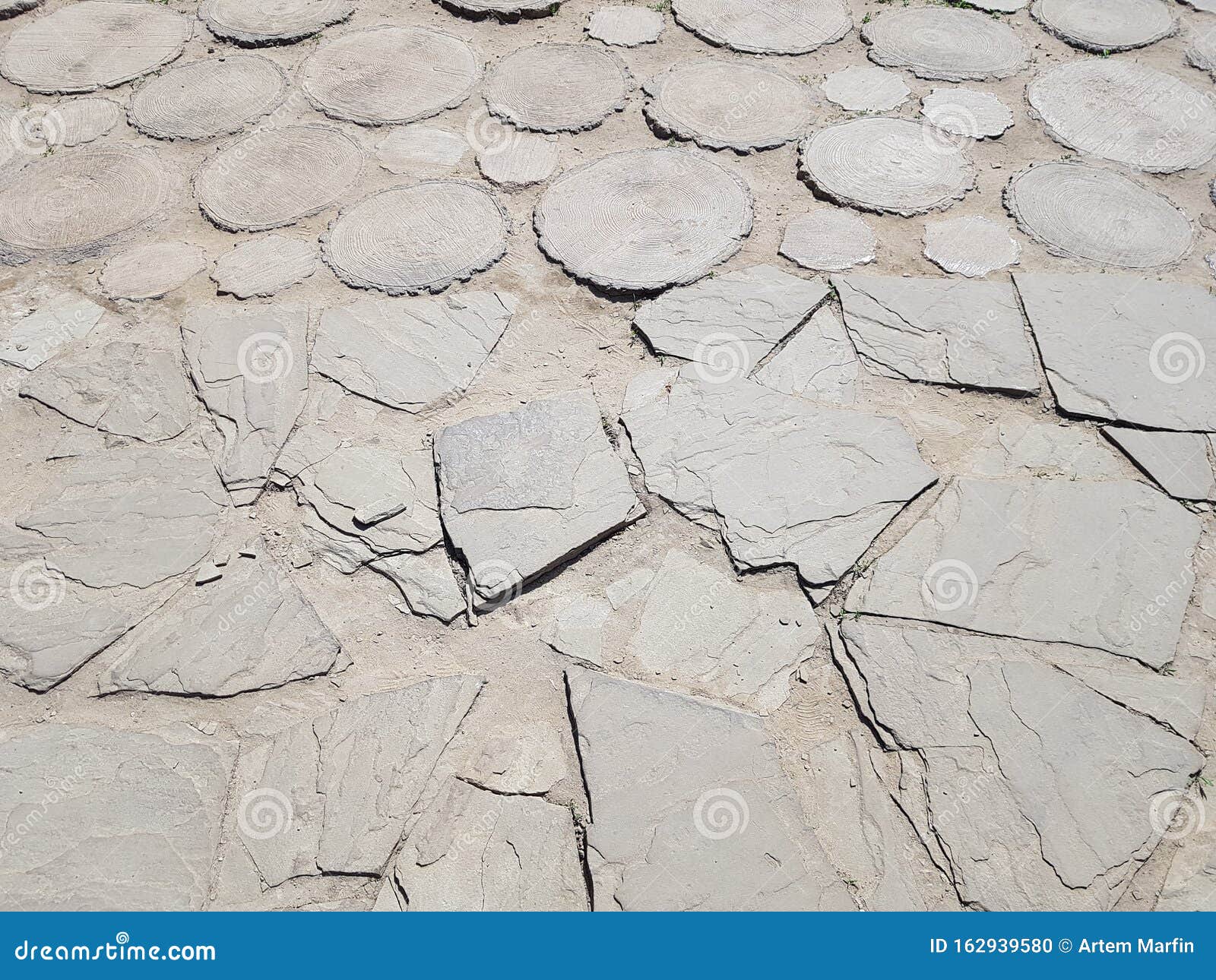 Coverage of Flat Stones with Sharp Edges and Wooden Saw Cuts on Dusty ...