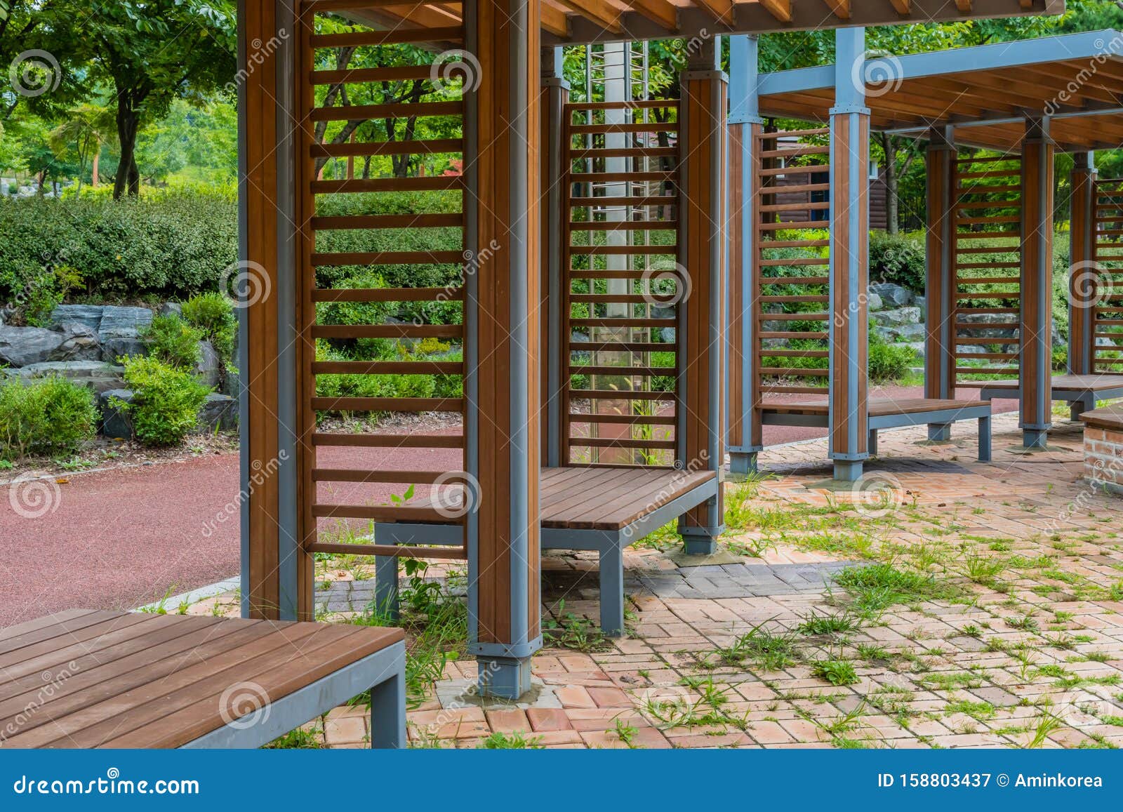Covered park benches stock image. Image of eastern, hillside - 158803437