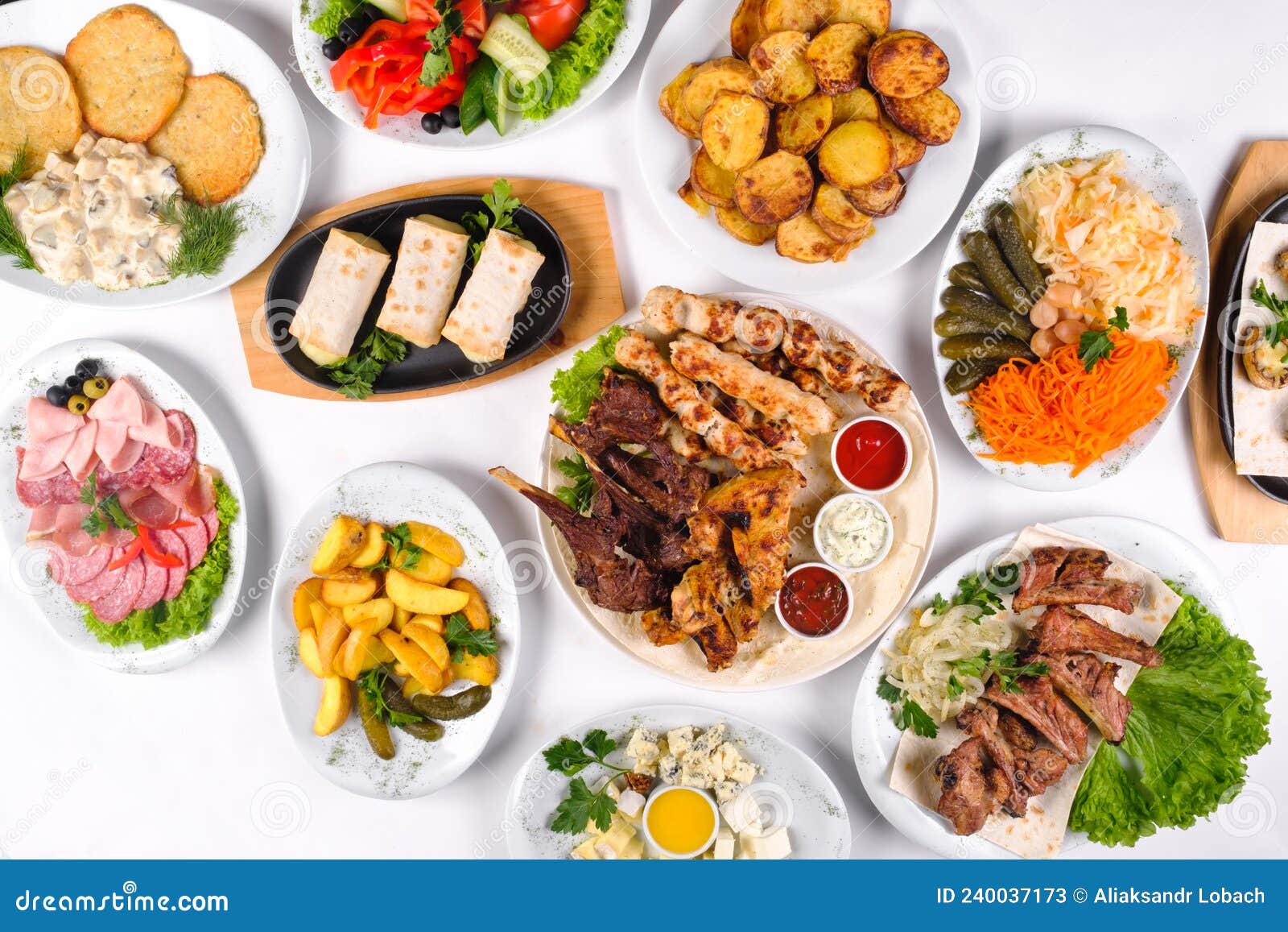 A Covered Table with Many Different Dinner Dishes. Lots of Food on a ...