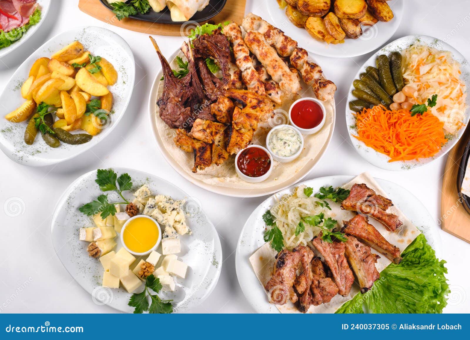 A Covered Table with Many Different Dinner Dishes. Lots of Food on a ...