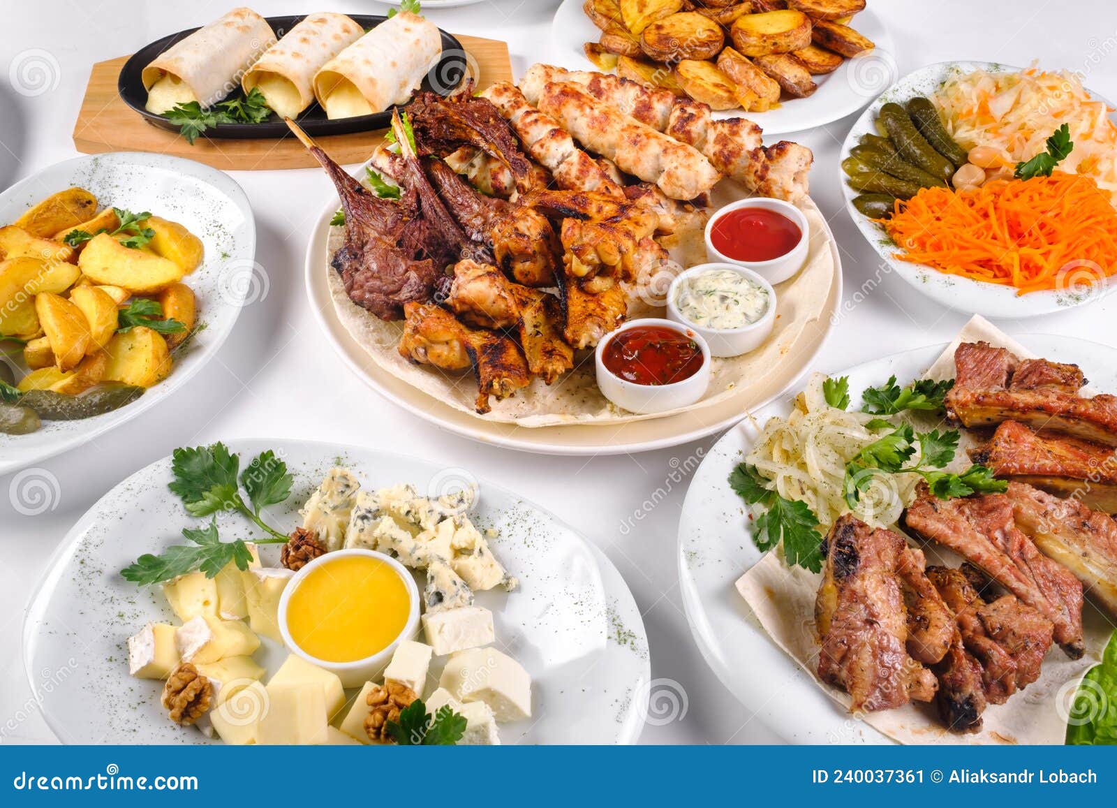 A Covered Table with Many Different Dinner Dishes. Lots of Food on a ...