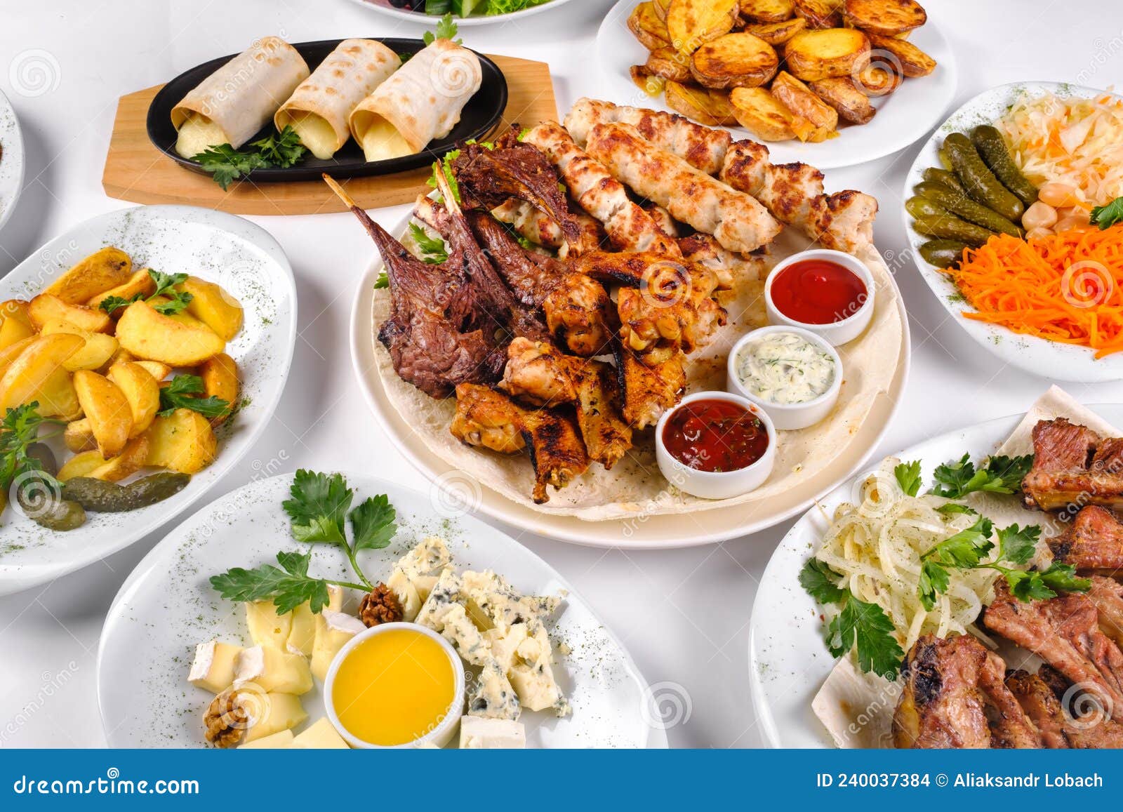 A Covered Table with Many Different Dinner Dishes. Lots of Food on a ...