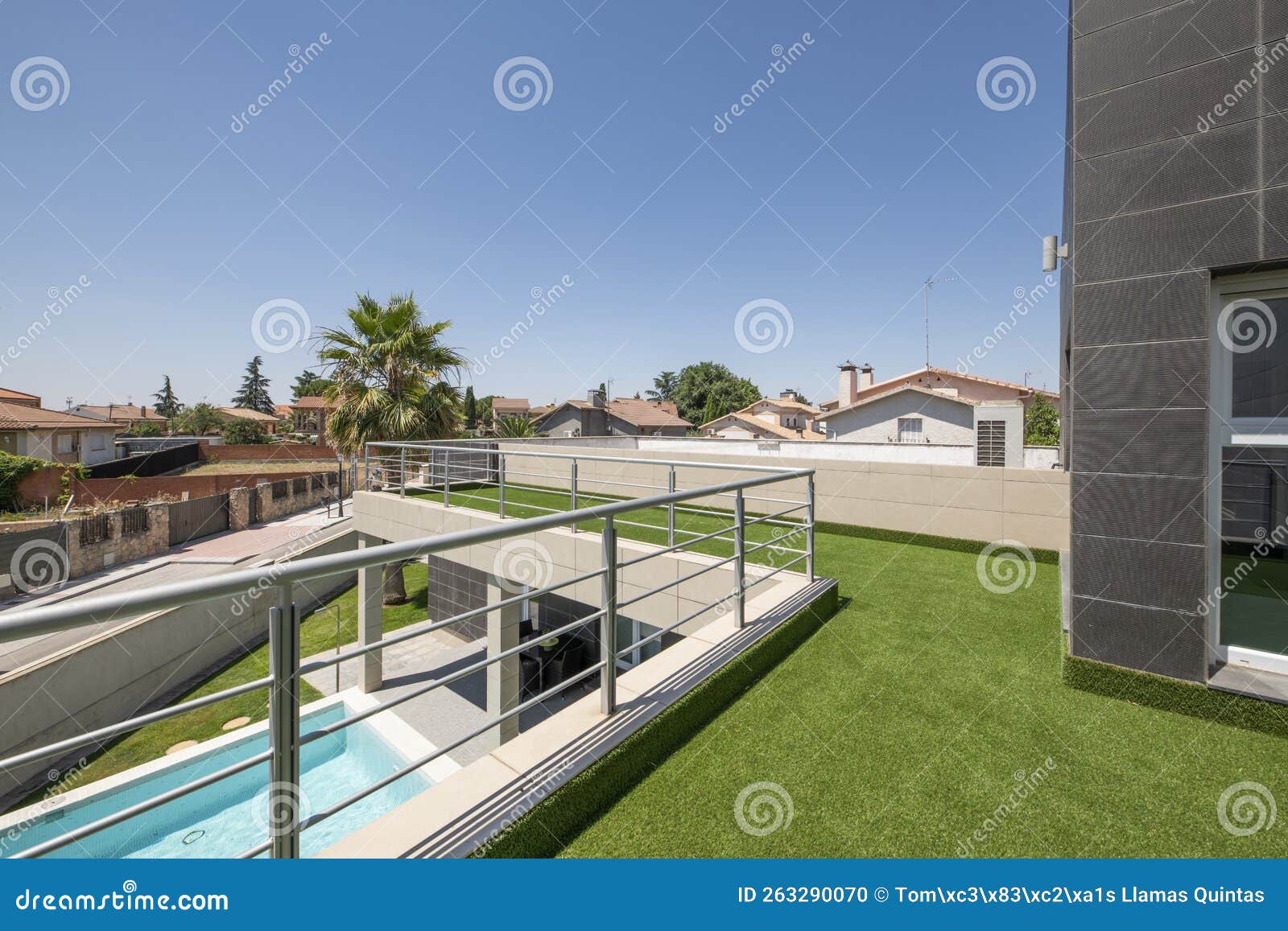 Covered Terrace with Artificial Grass Overlooking a Summer Pool Stock ...