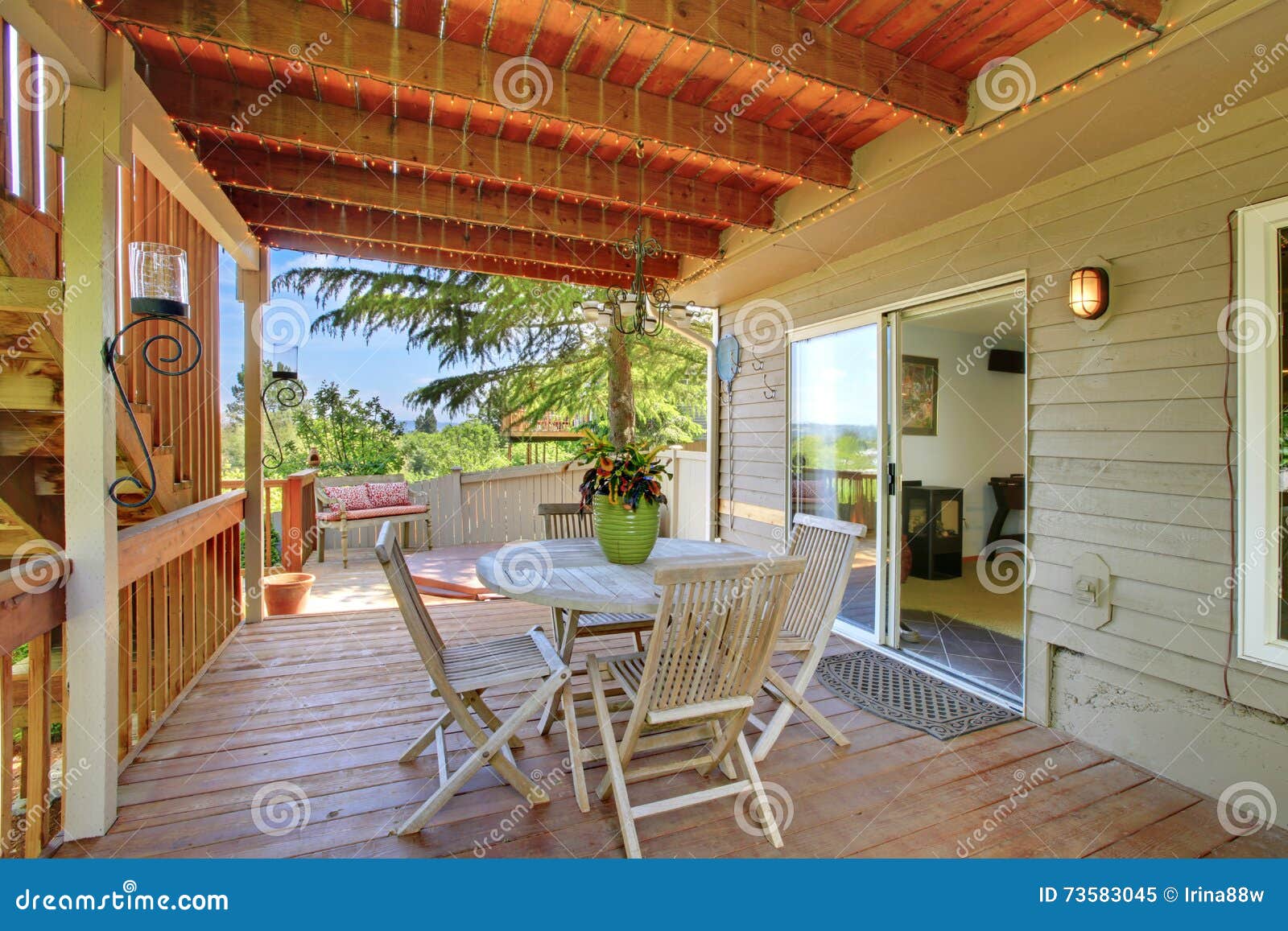 Covered Walkout Deck with Dining Table Set and Glass Slide Doors. Stock ...