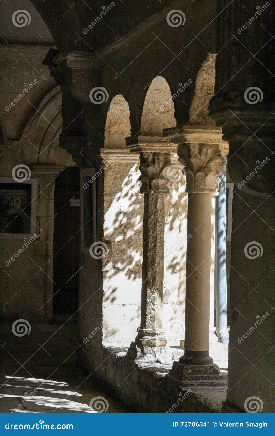 A Covered Walkway with Ancient Arches and Columns Stock Image - Image ...