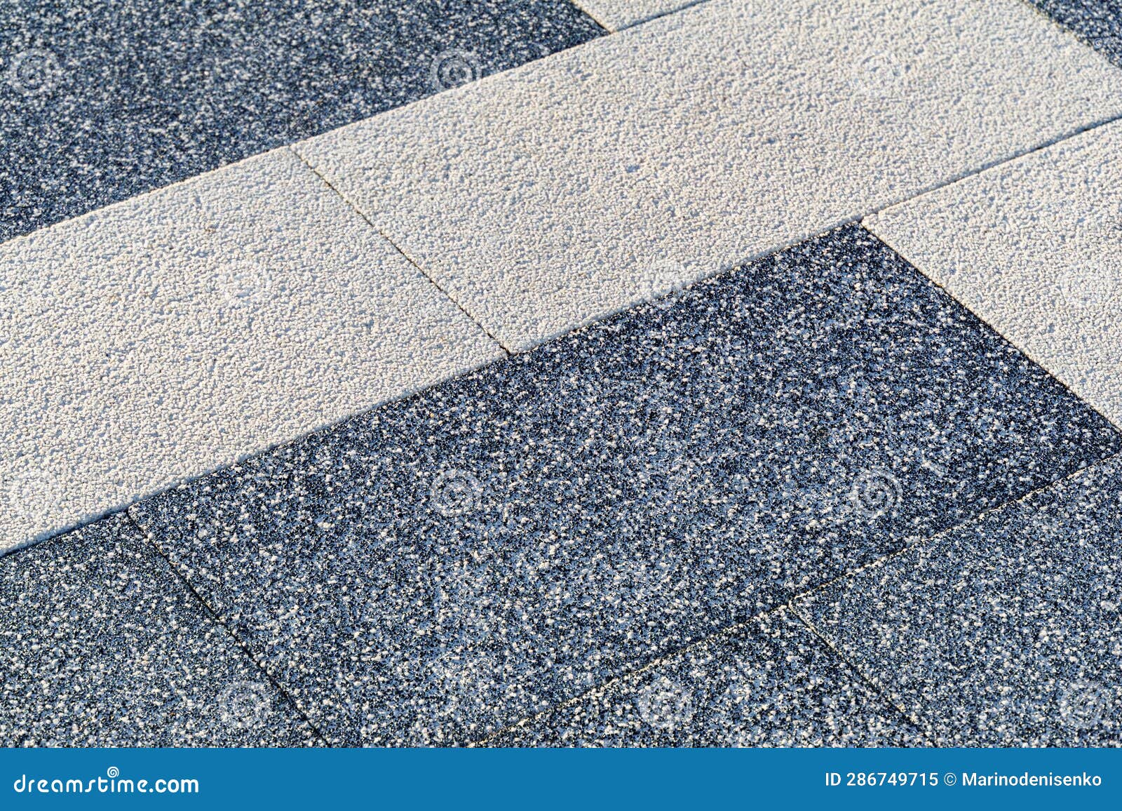 Covering the Footpath of Light and Dark Gray Tiles. Modern Textured ...