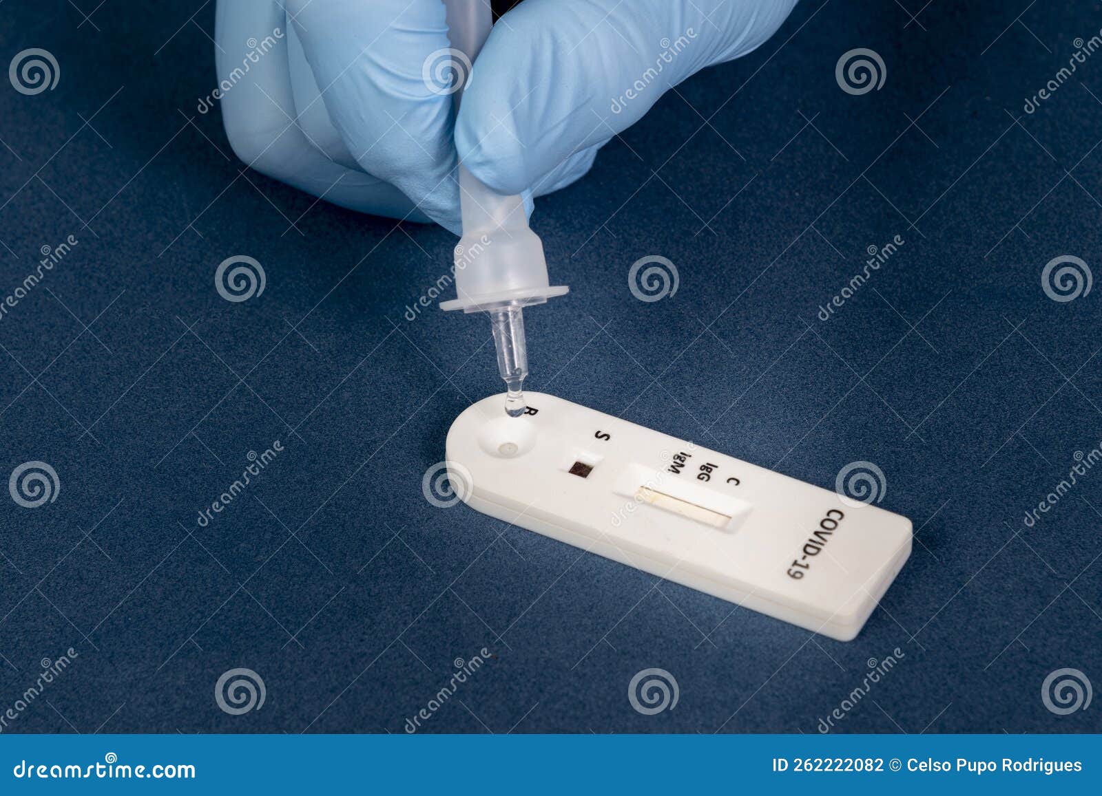 Covid-19 Rapid Test with Person Dripping the Reagent Stock Photo ...
