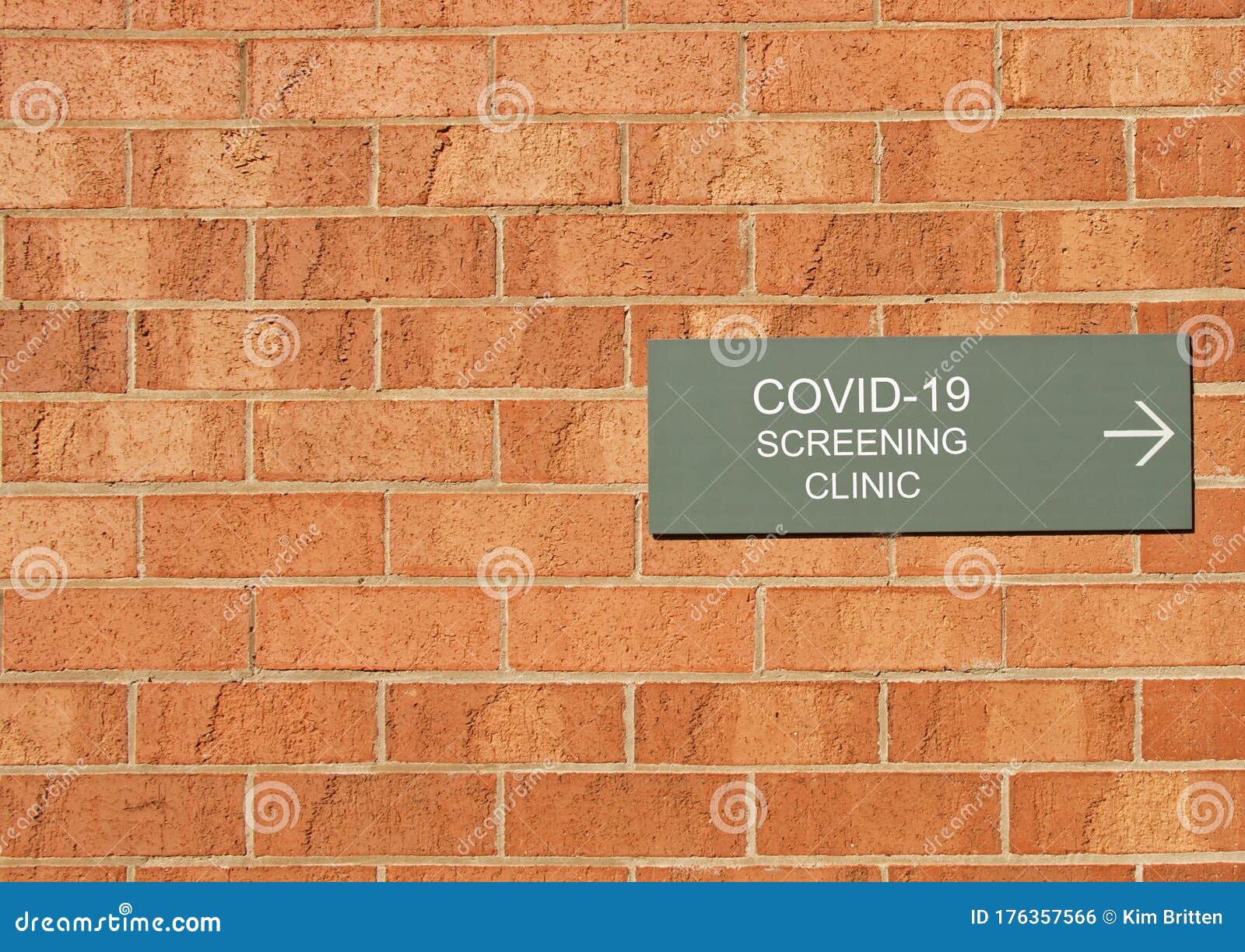 COVID-19 Screening Clinic Sign on a Red Brick Wall Stock Photo - Image ...