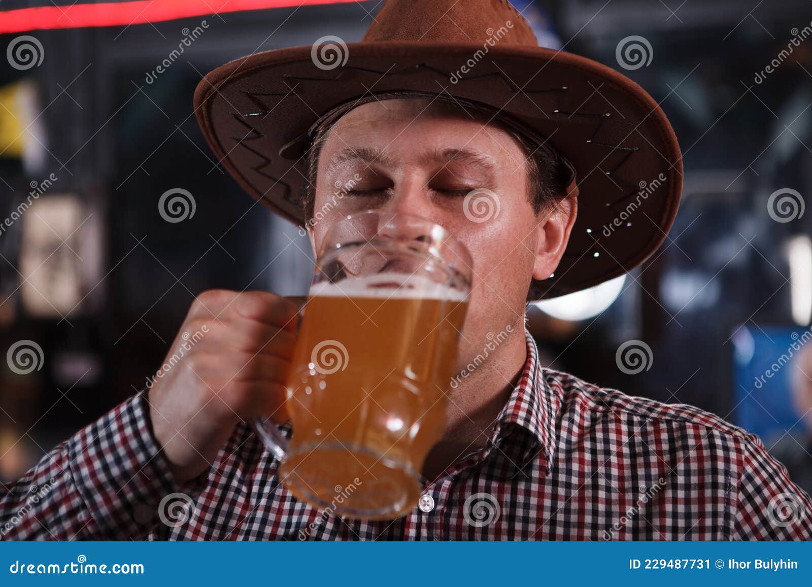 Cowboy Drinking Beer at the Saloon Stock Image - Image of saloon ...
