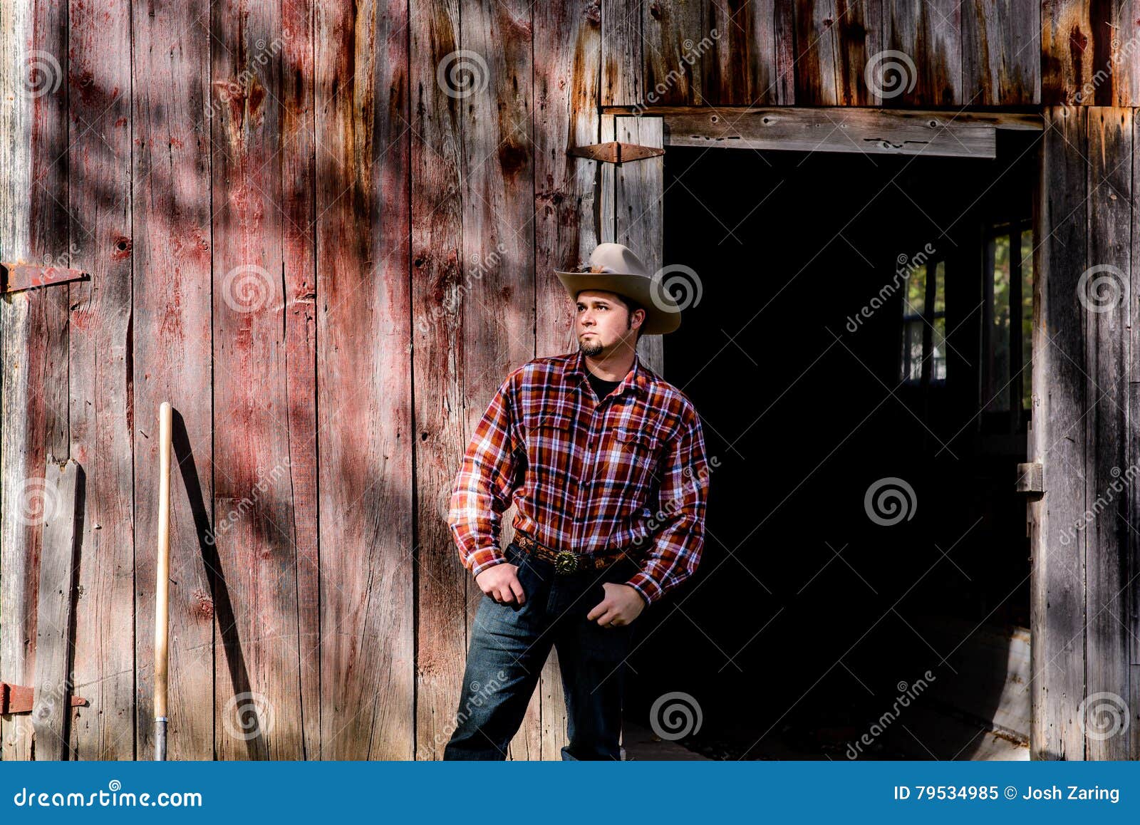 Cowboy in Flannel and Thumbs in Pocket Stock Image - Image of cowboy ...
