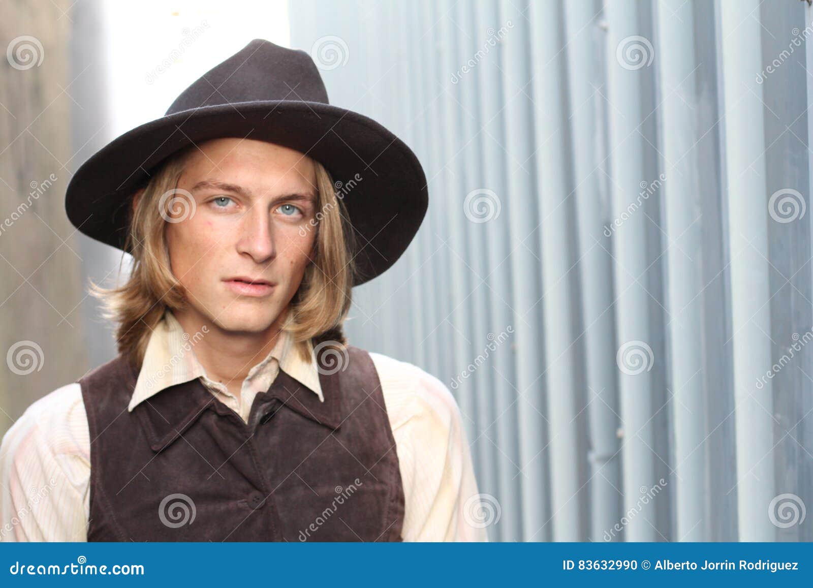 Cowboy Hat, Camera, Compass, Geographic Map, Old Paper Scroll On A Blue ...