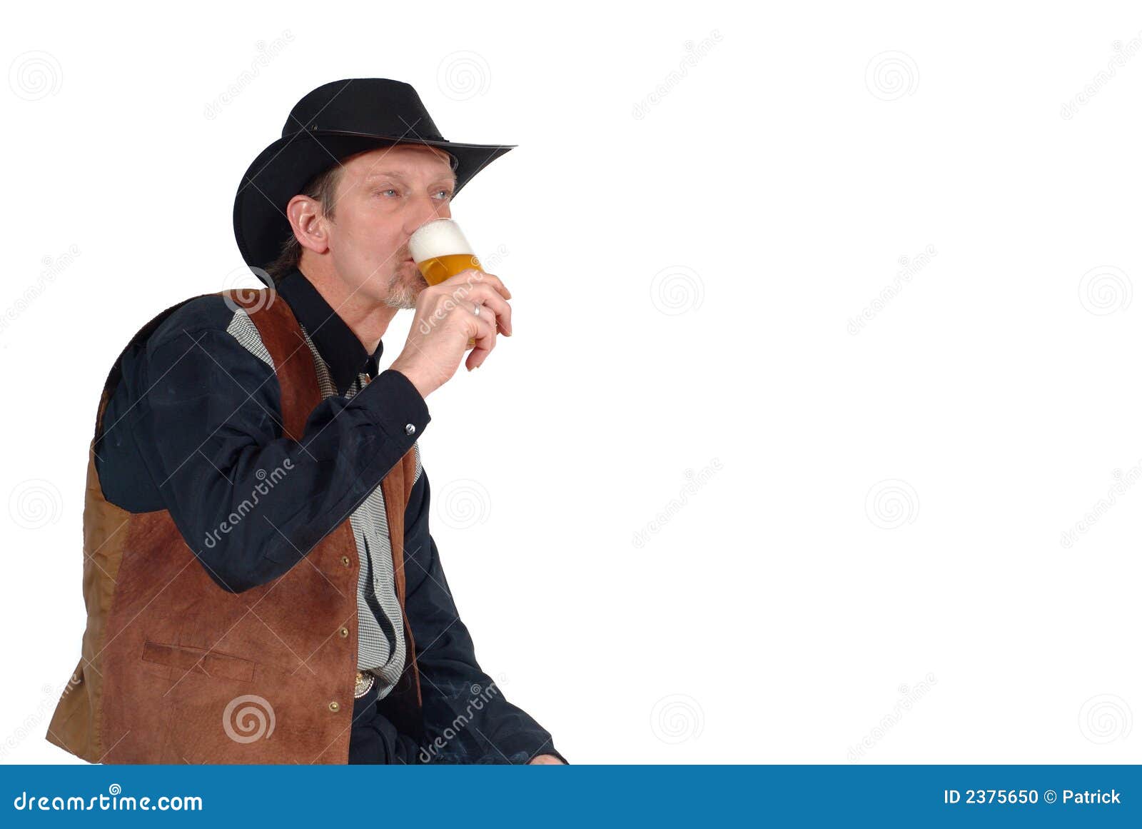 Cowboy having a beer stock photo. Image of drink, middle - 2375650