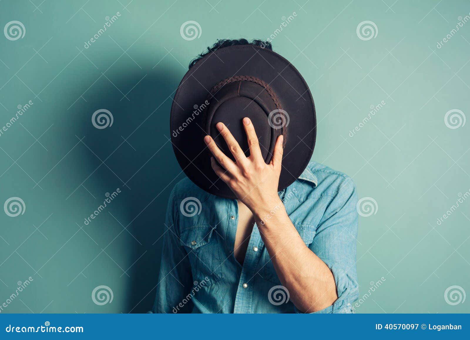 Cowboy Hiding Behind His Hat Stock Image - Image of attractive, happy ...