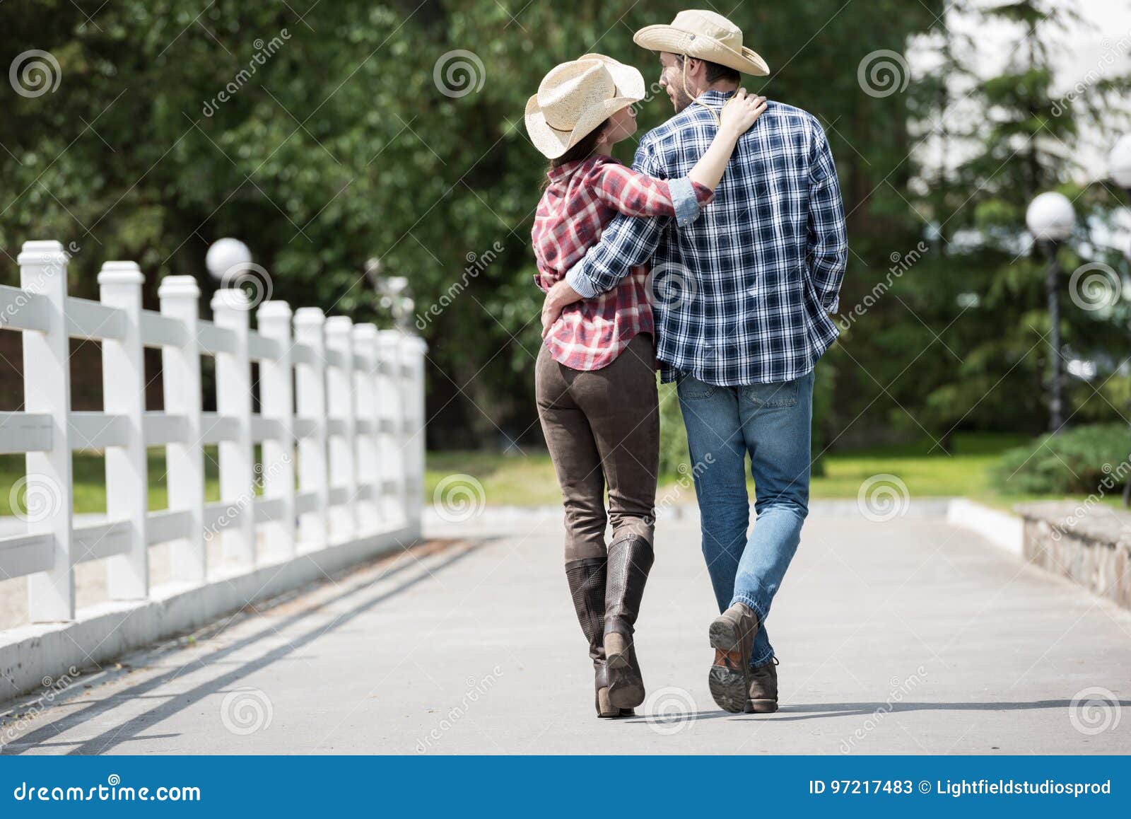 Cowboy with His Girlfriend Walking on Pathway in Park at Daytime Stock ...