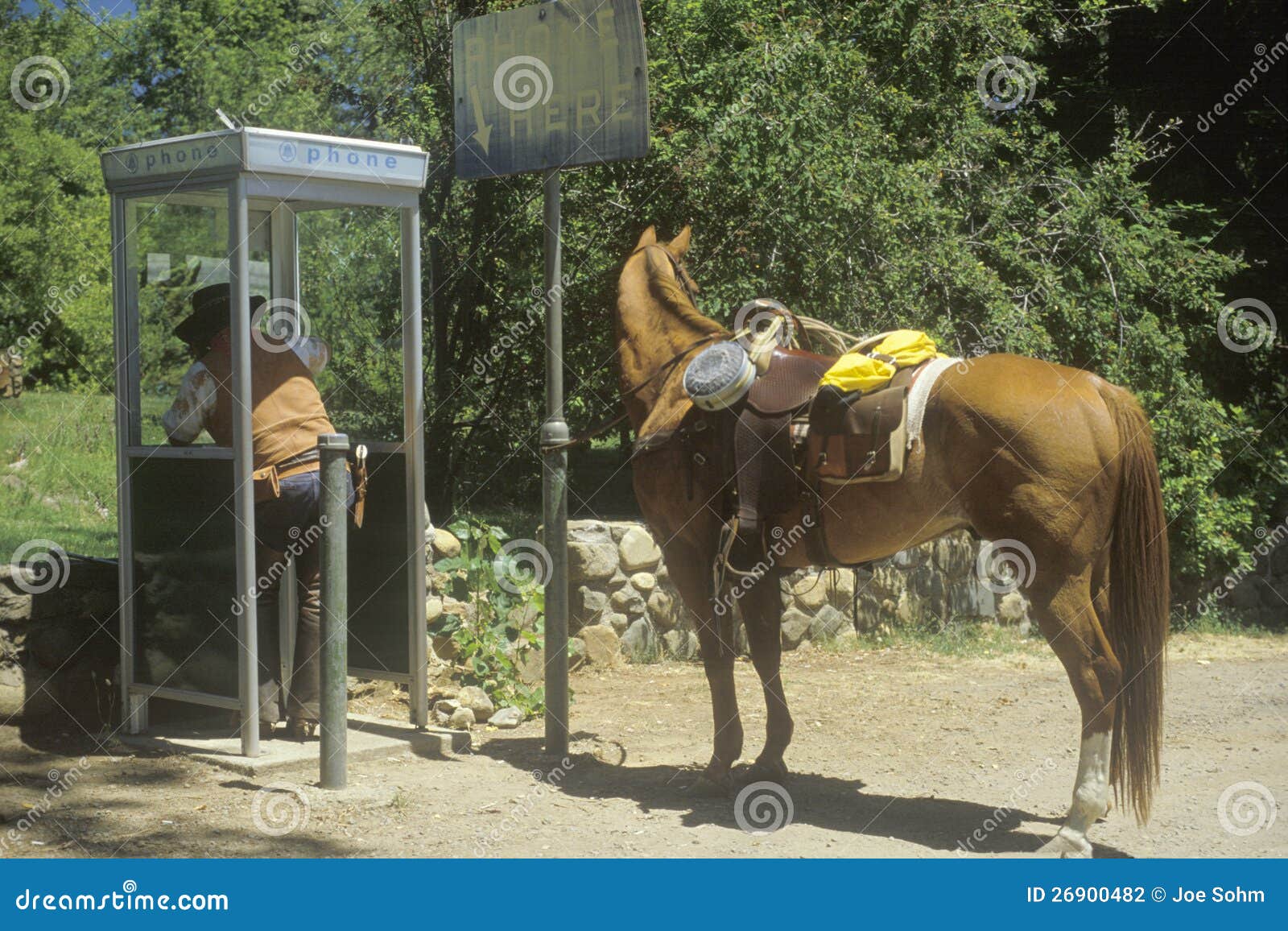 Cowboy making phone call editorial photography. Image of reenactment ...