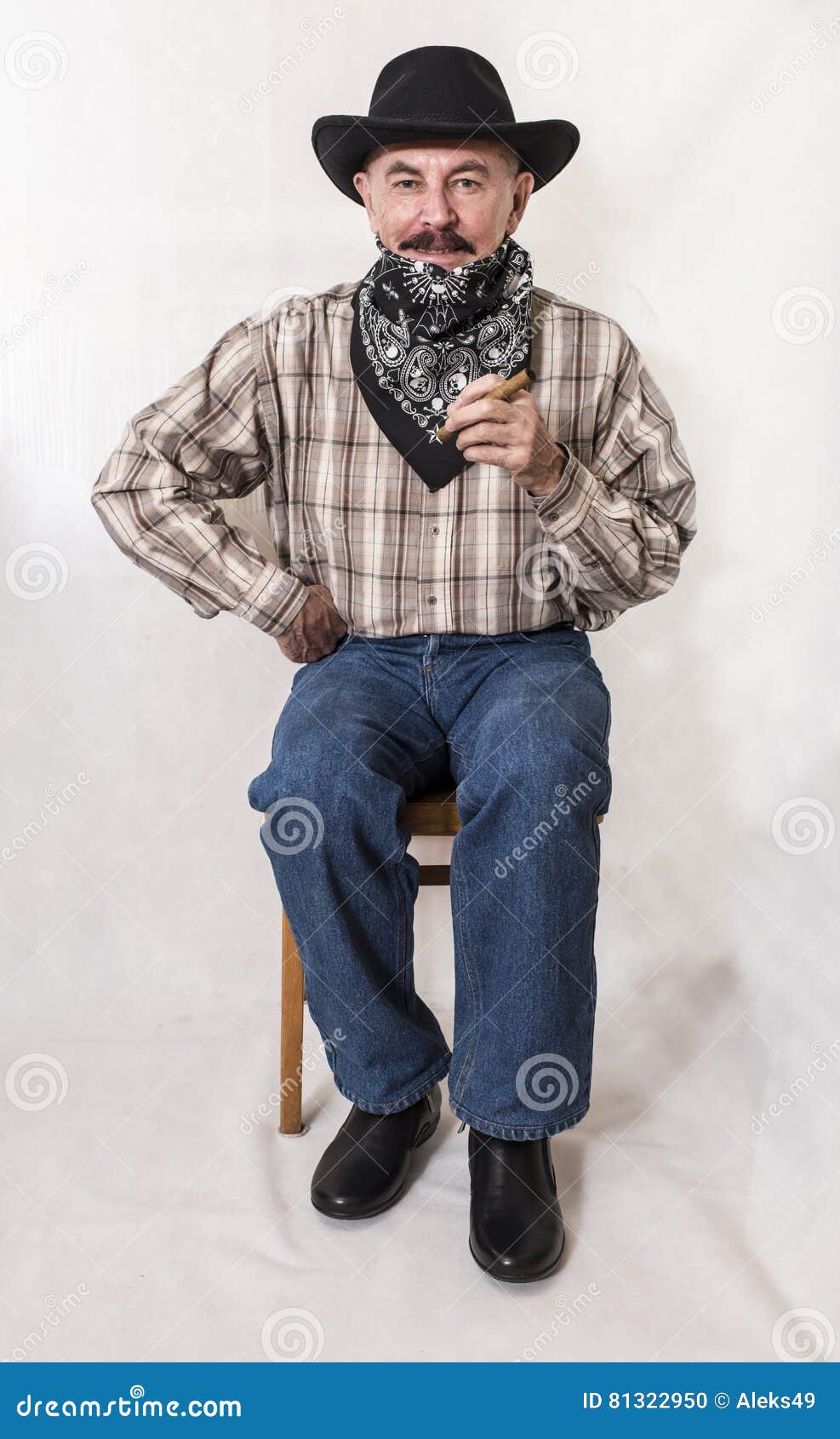 The Cowboy with Mustache, in a Black Hat Smoking a Cigar Stock Photo ...