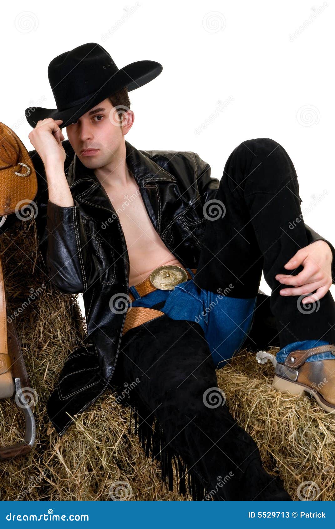 Cowboy op hooi stock afbeelding. Image of zadel, mens - 5529713