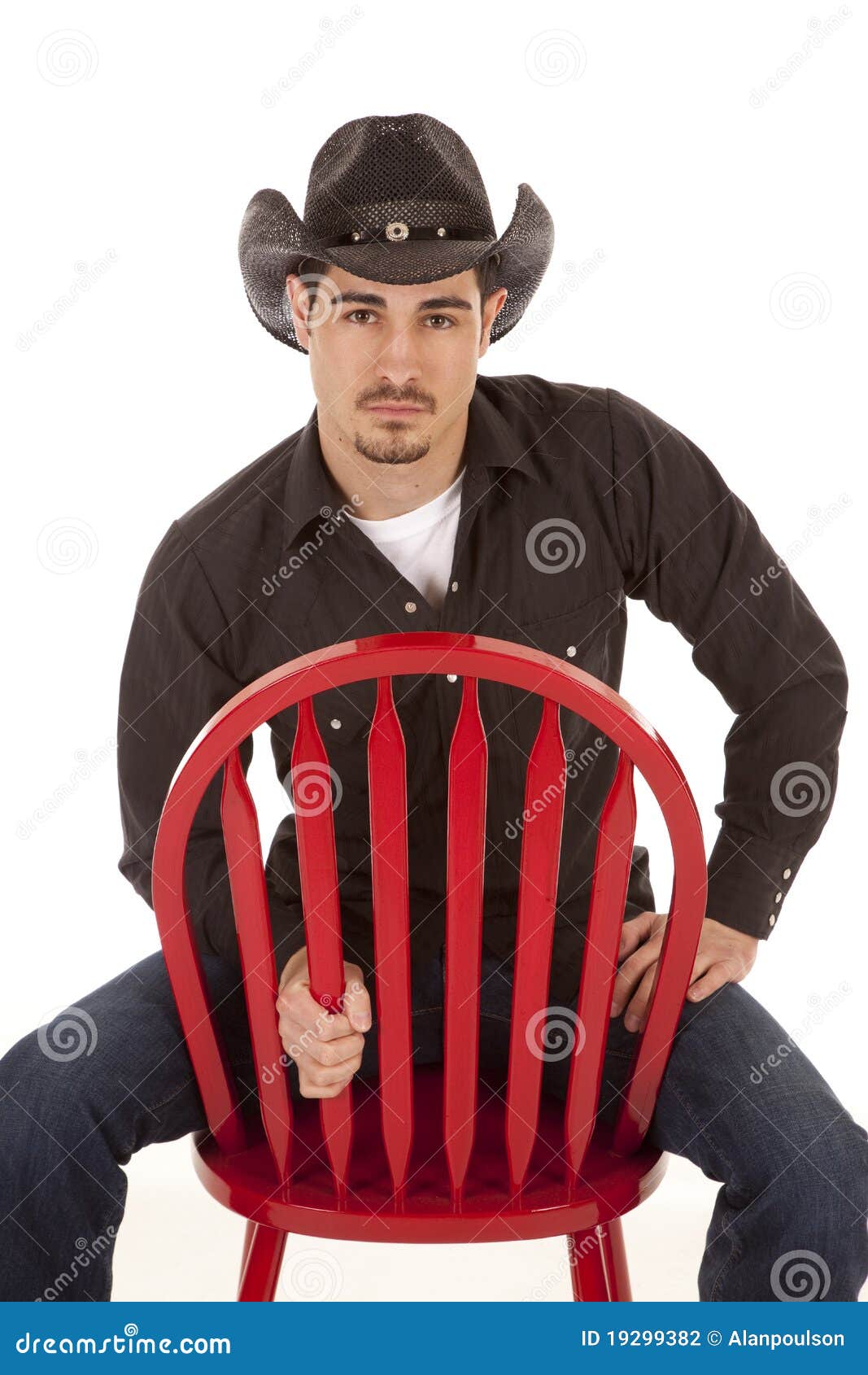 Cowboy red chair serious stock photo. Image of adult - 19299382