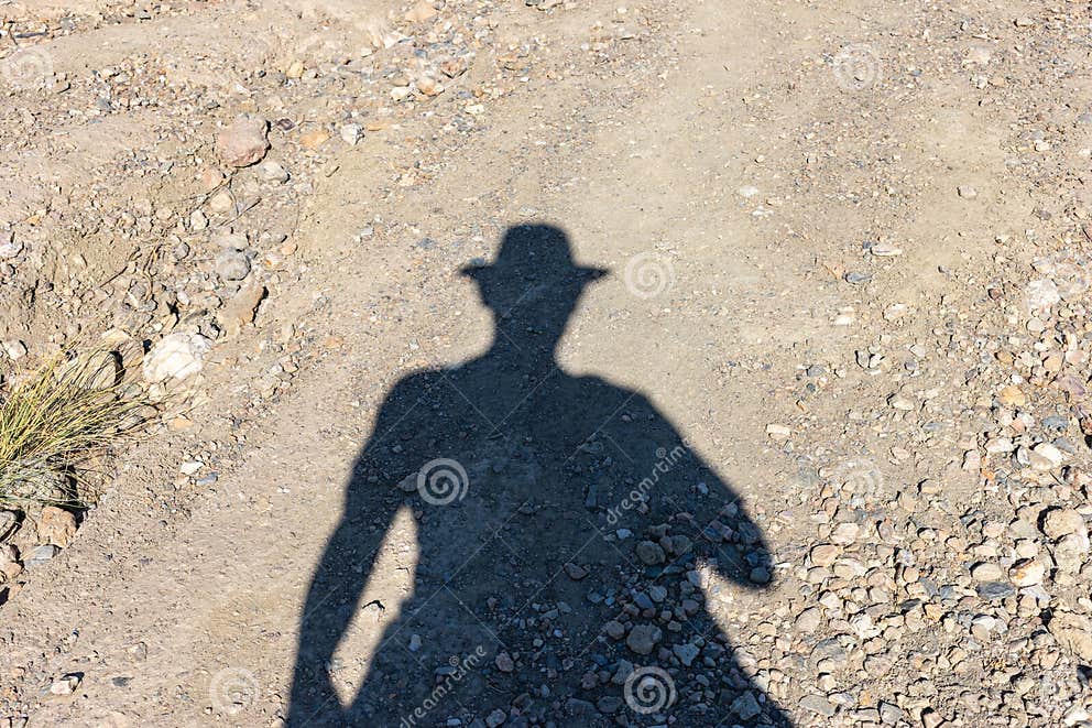 Cowboy Shadow with Hat on the Desert Floor Stock Photo - Image of ...