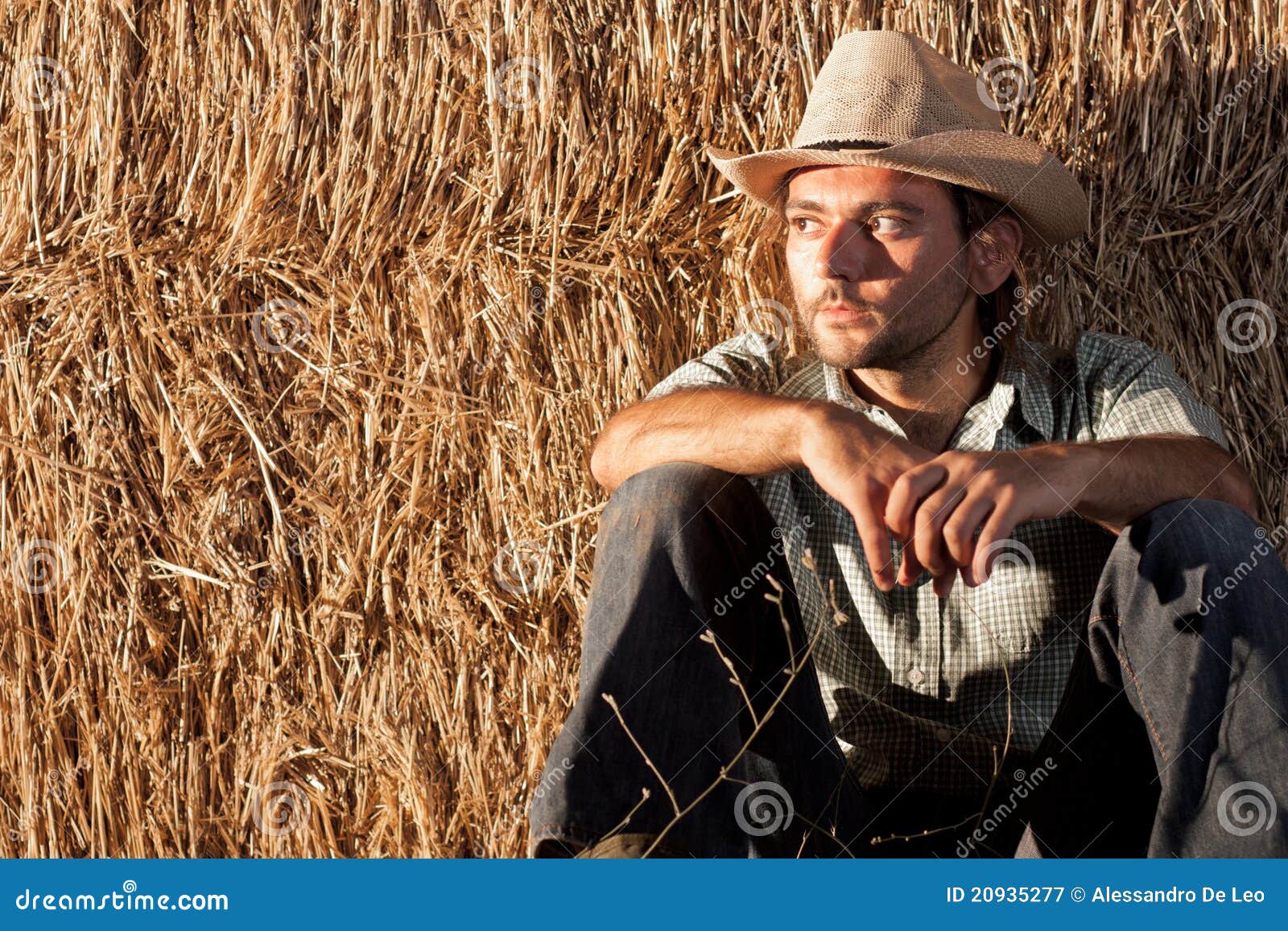 Cowboy Sitting on the Ground Stock Image - Image of cowboy, serious ...