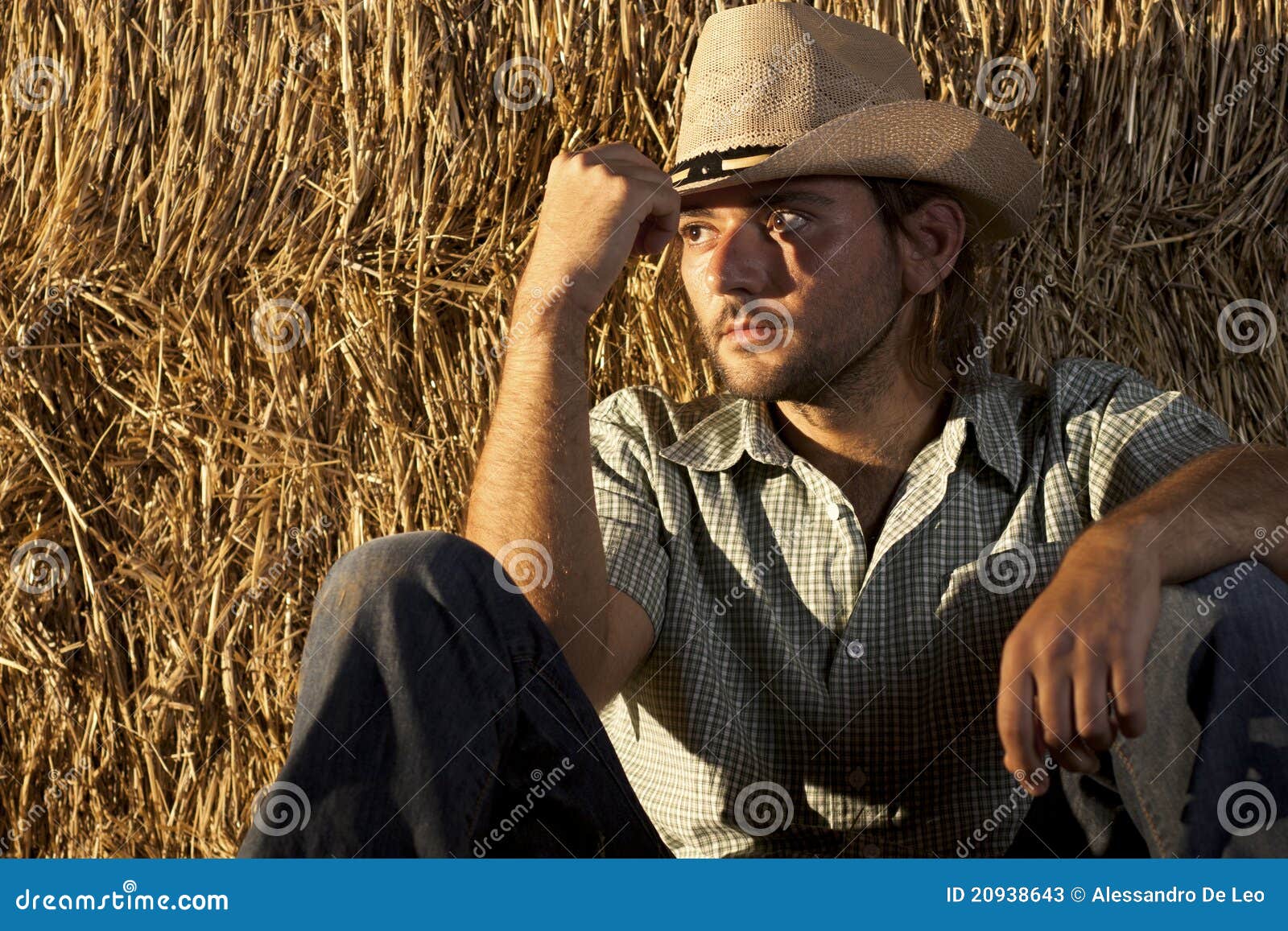 Cowboy Sitting On The Ground Stock Photos - Image: 20938643