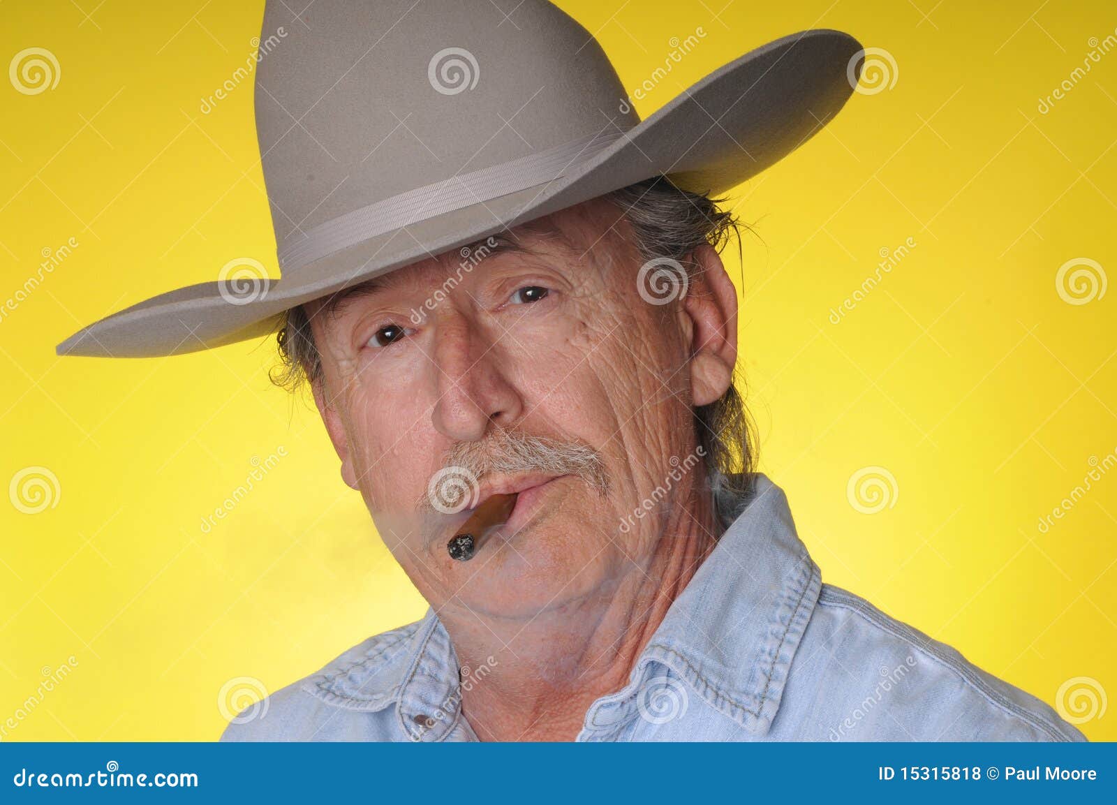 Cowboy smoking a Cigar stock photo. Image of countryman - 15315818