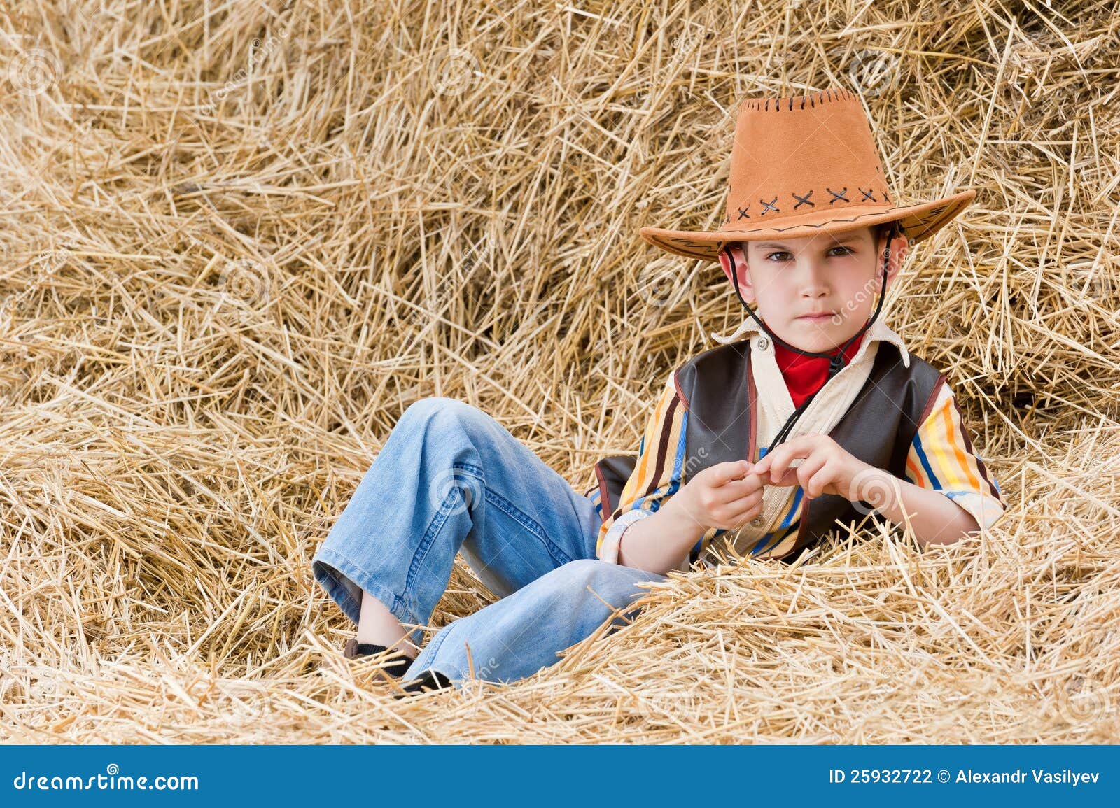 Cowboy on straw stock photo. Image of sits, serious, carefree - 25932722