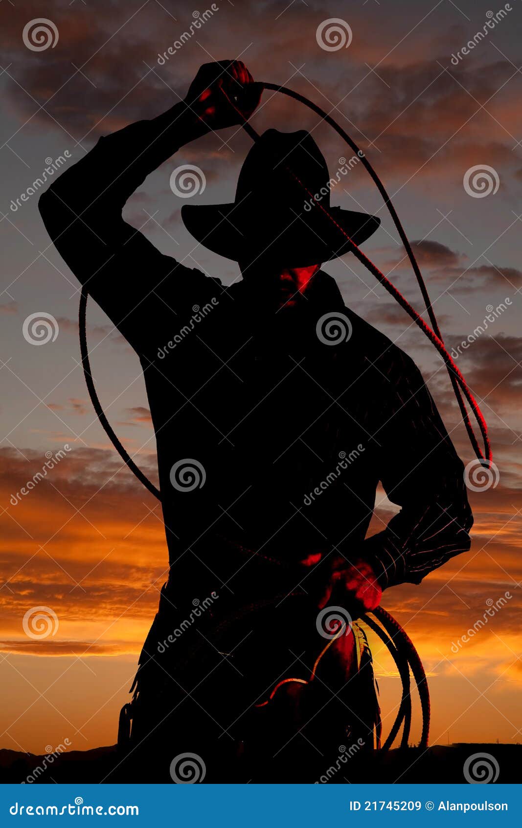 Cowboy in sunset with rope stock image. Image of color - 21745209