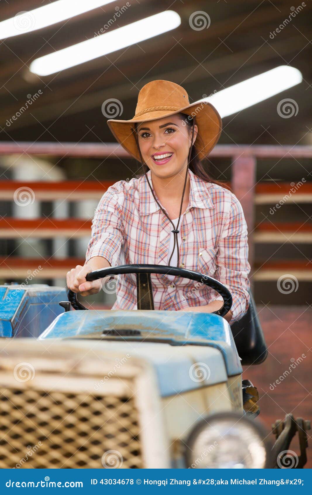 Cowgirl driving tractor stock photo. Image of happy, cheerful - 43034678