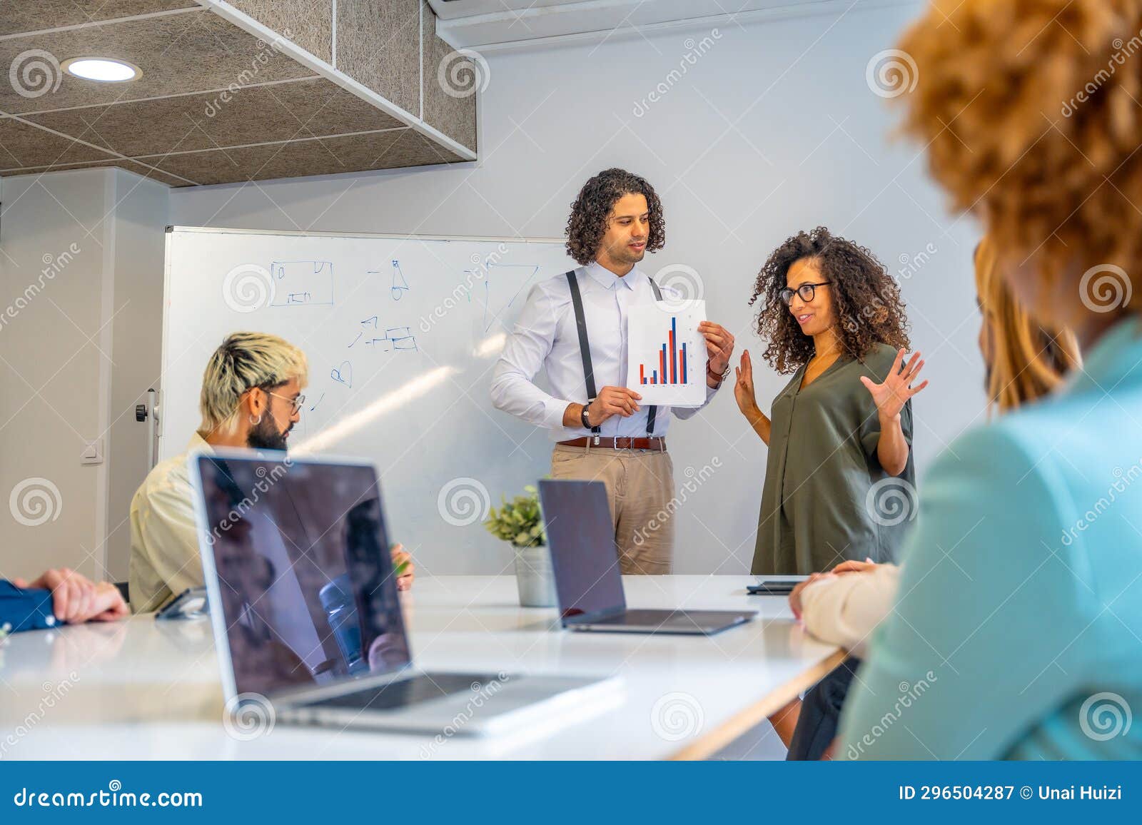 Coworkers Analyzing Data in a Meeting Together Stock Image - Image of ...