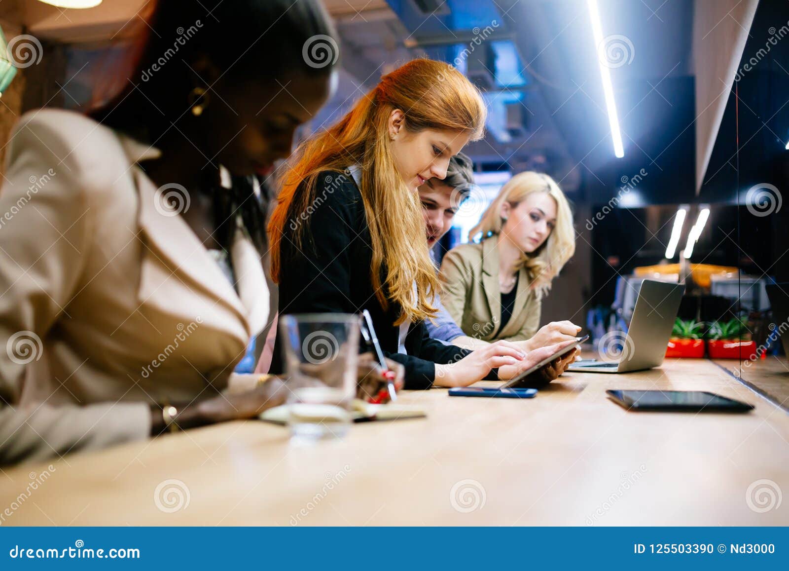 Coworkers bonding in pub stock photo. Image of friendship - 125503390