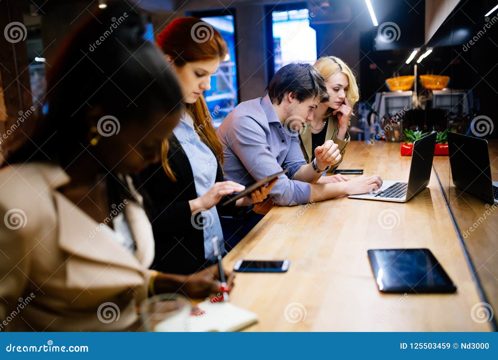 Coworkers bonding in pub stock image. Image of lifestyles - 125503459