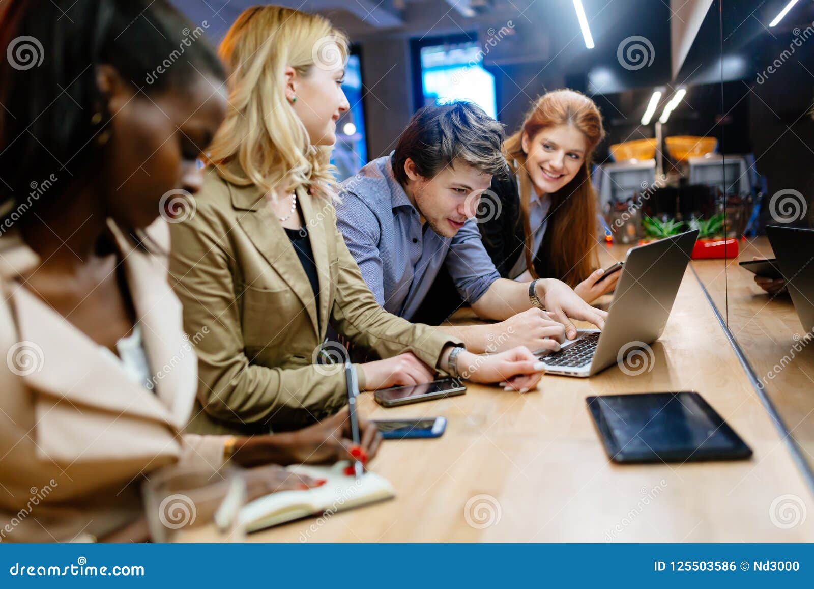 Coworkers bonding in pub stock photo. Image of glass - 125503586