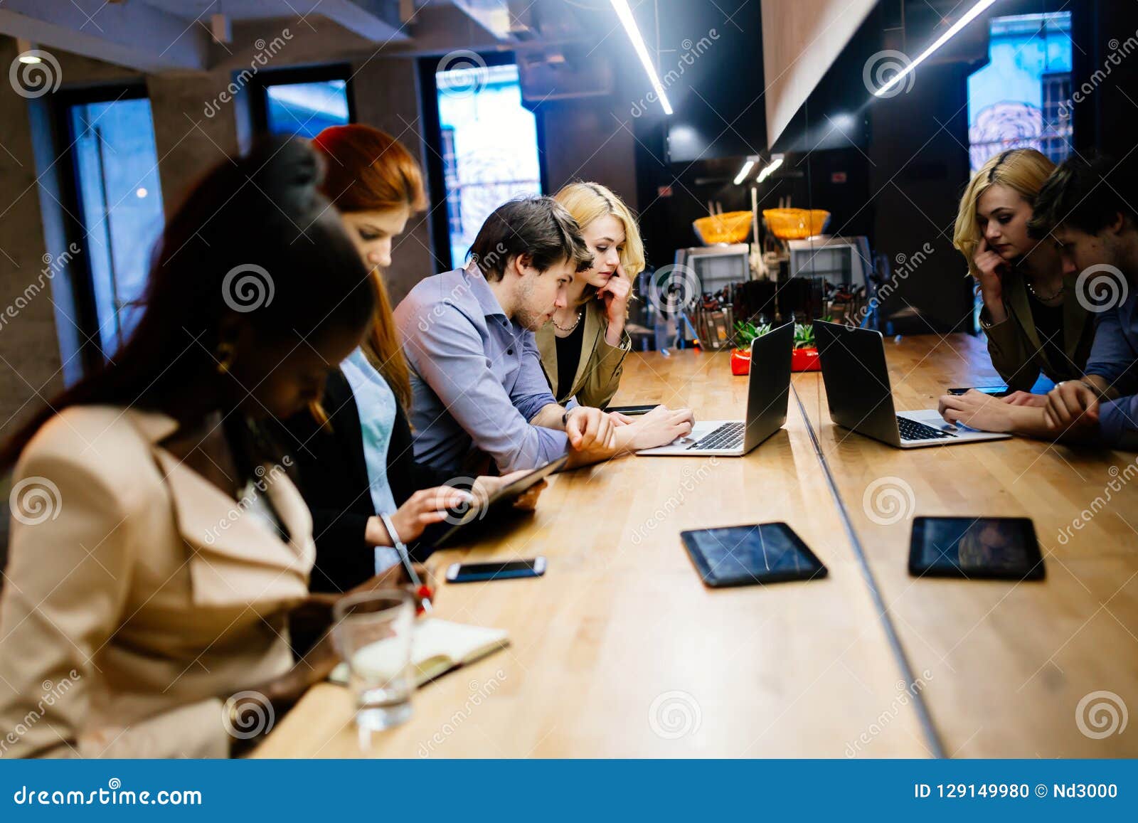 Coworkers bonding in pub stock photo. Image of male - 129149980
