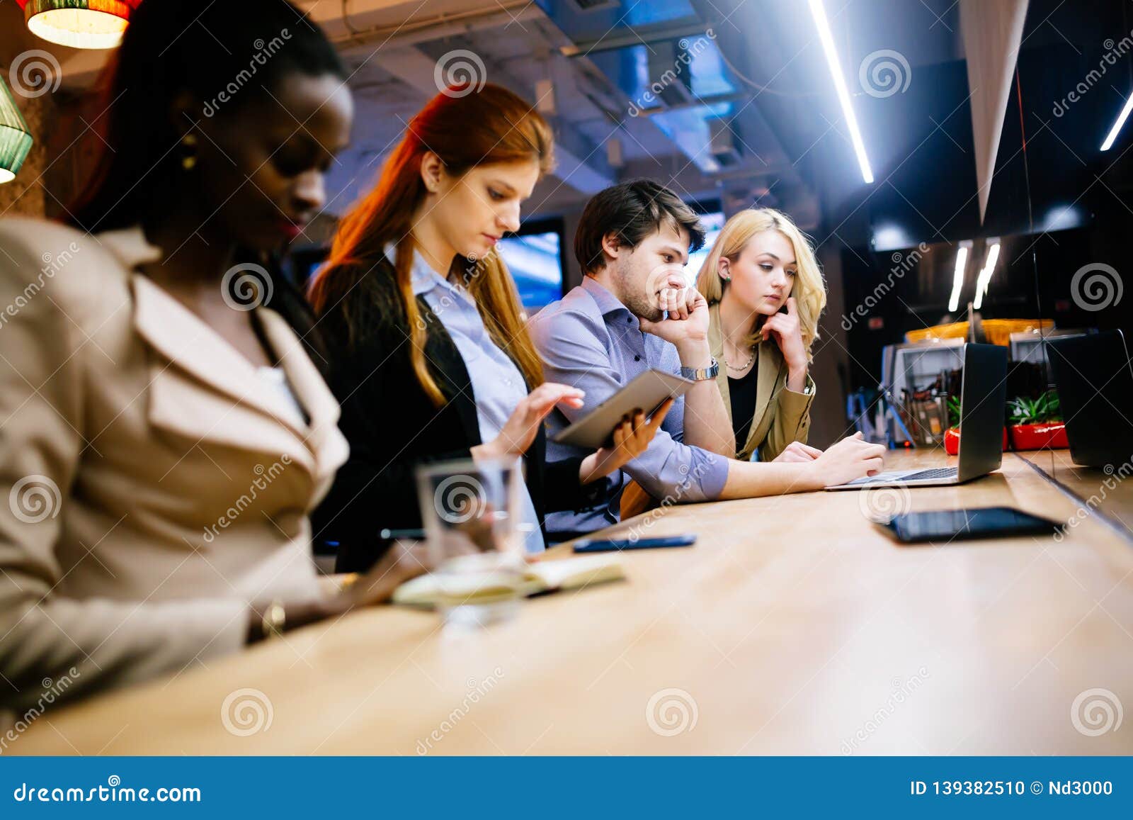 Coworkers bonding in pub stock photo. Image of corporate - 139382510
